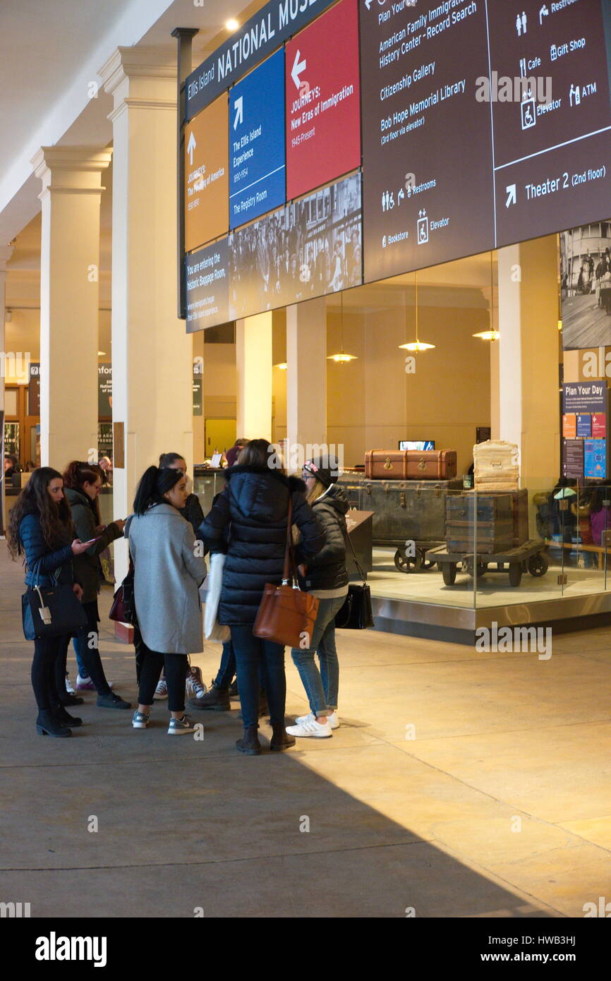 Tourists in Ellis Island Baggage Room Stock Photo - Alamy