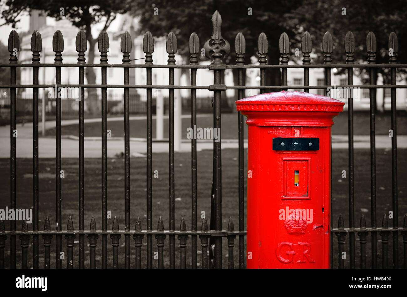 Red post box in street with historical architecture in London Stock ...