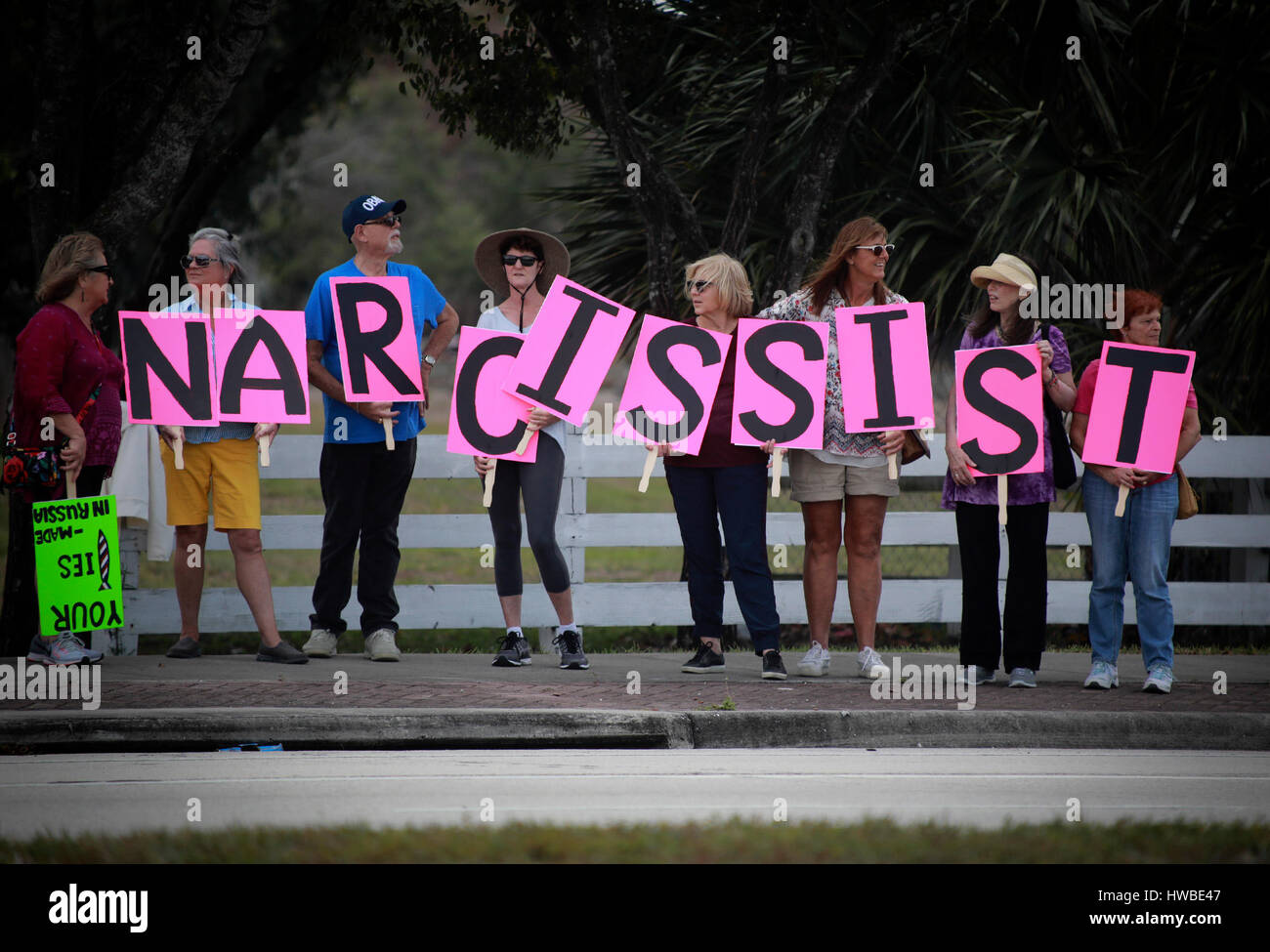 Florida, USA. 19th Mar, 2017. Protesters hold signs on Southern ...