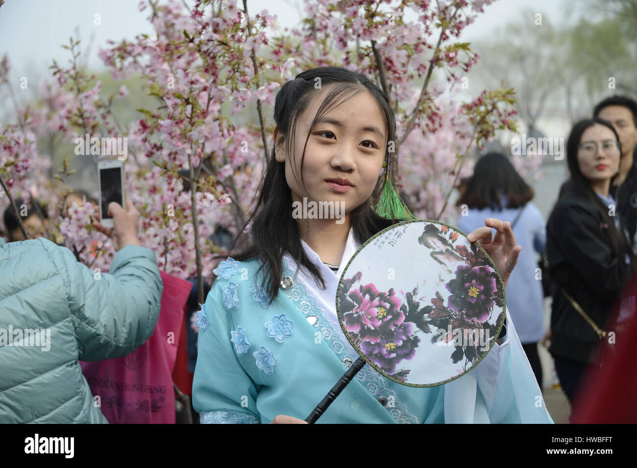 Beijing, China. 19th Mar, 2017. A girl wearing Chinese traditional ...