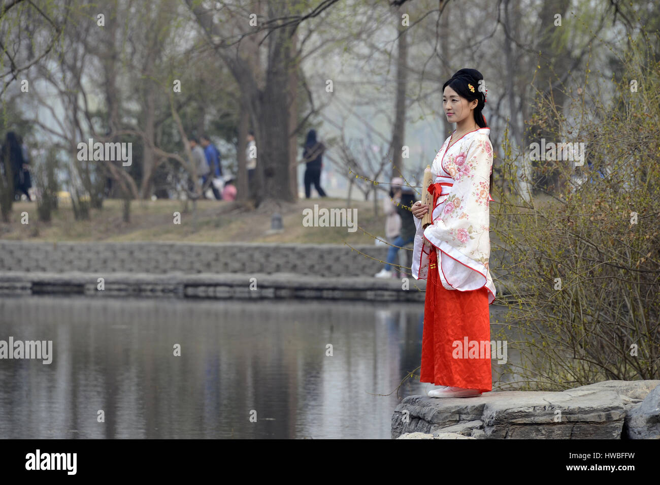Beijing, China. 19th Mar, 2017. A girl wearing Chinese traditional ...
