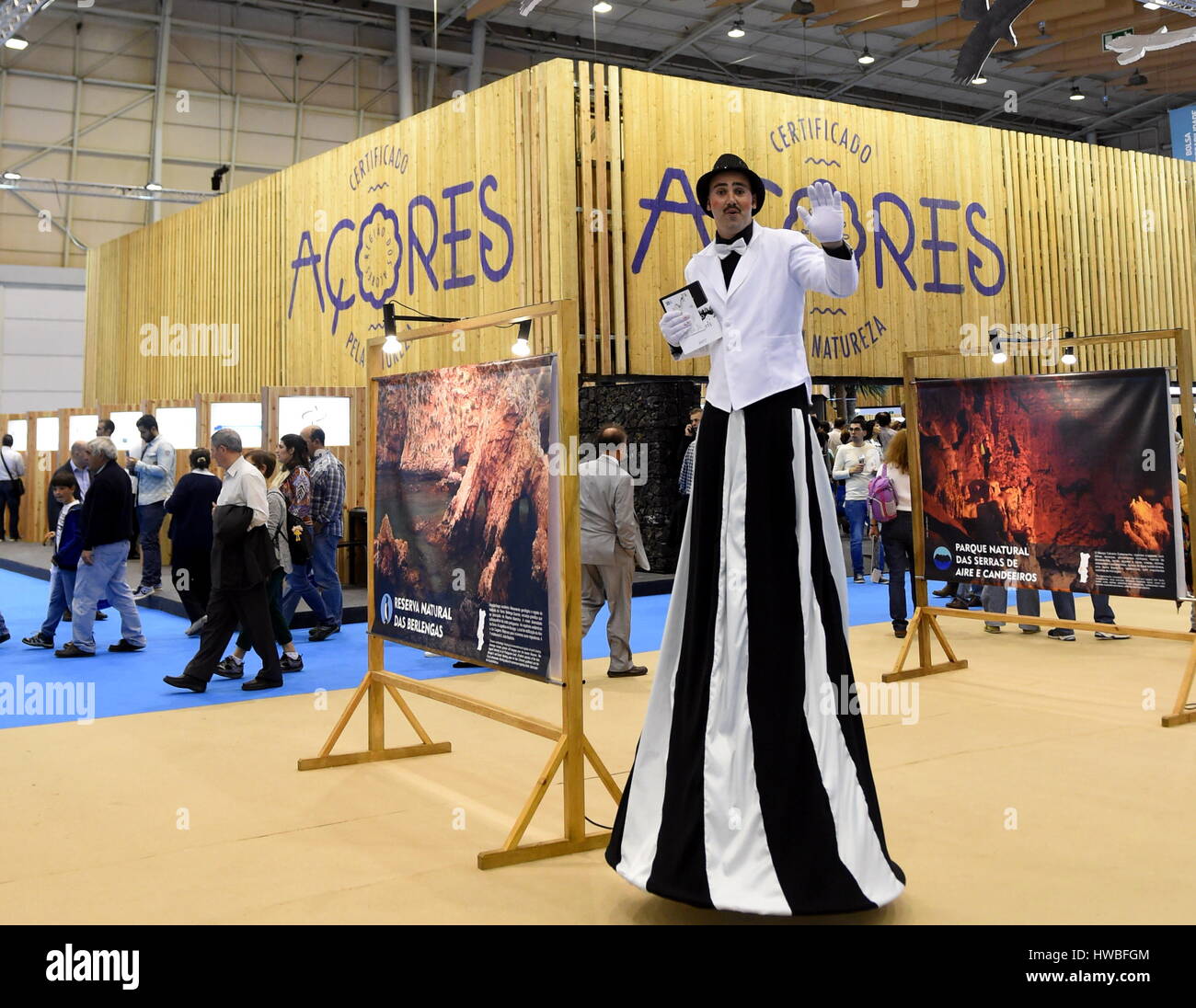 Lisbon, Portugal. 19th Mar, 2017. An exhibitor introduces products at ...