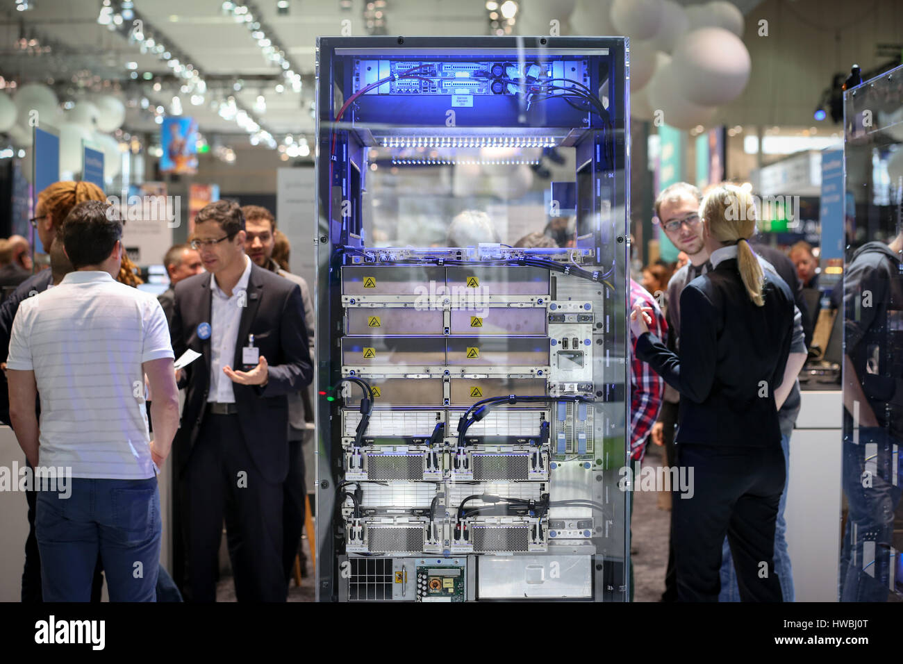 Hanover, Germany. 20th Mar, 2017. Visitors stand at the IBM stall next ...