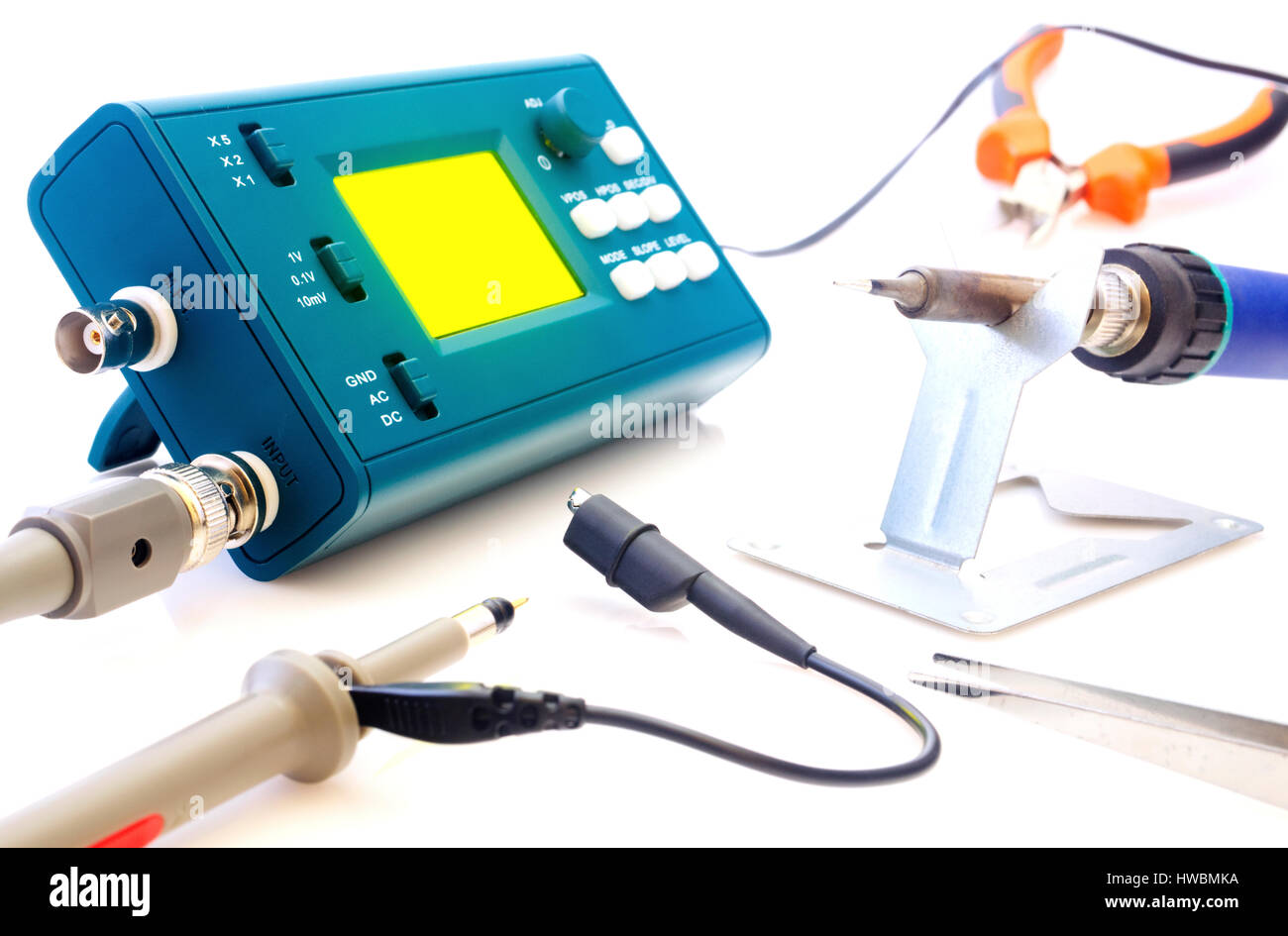 Modern digital signal oscilloscope and tools isolated on white ...