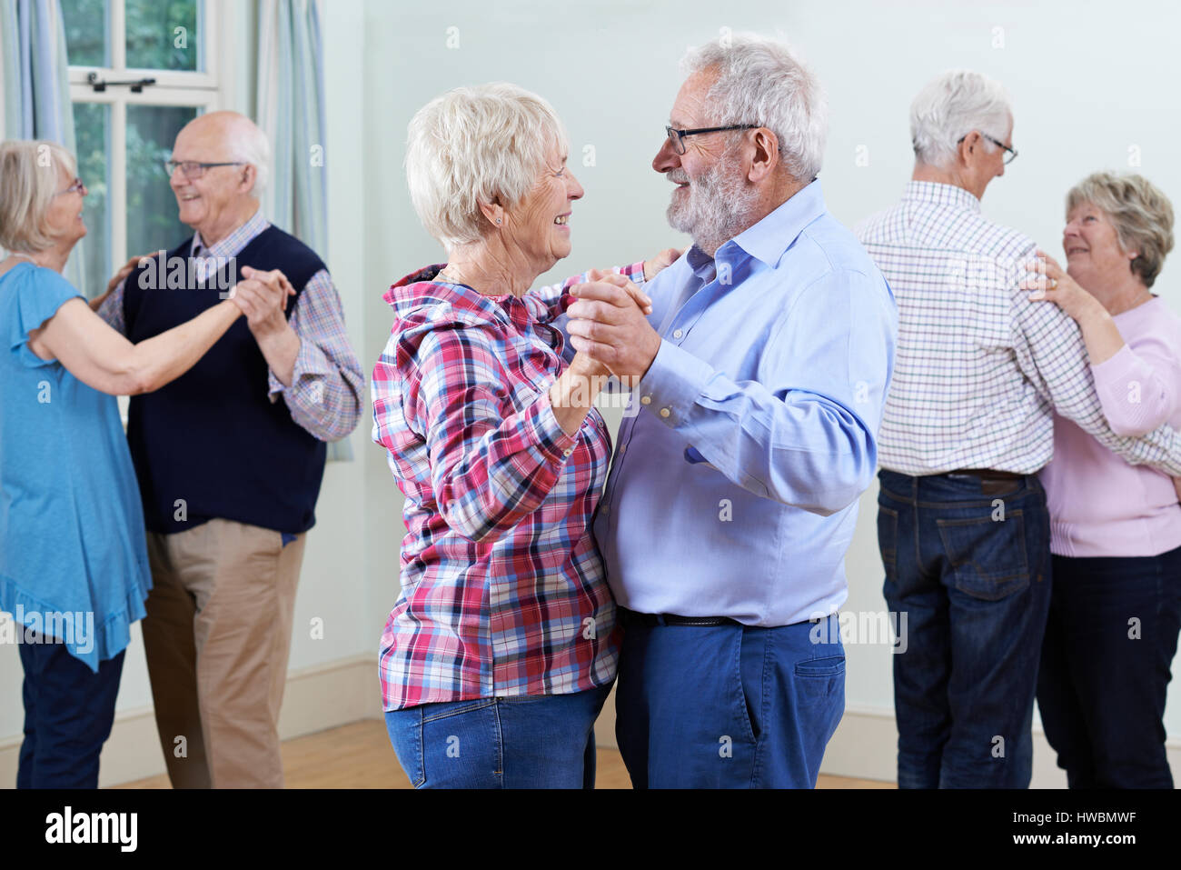 Group Of Seniors Enjoying Dancing Club Together Stock Photo - Alamy