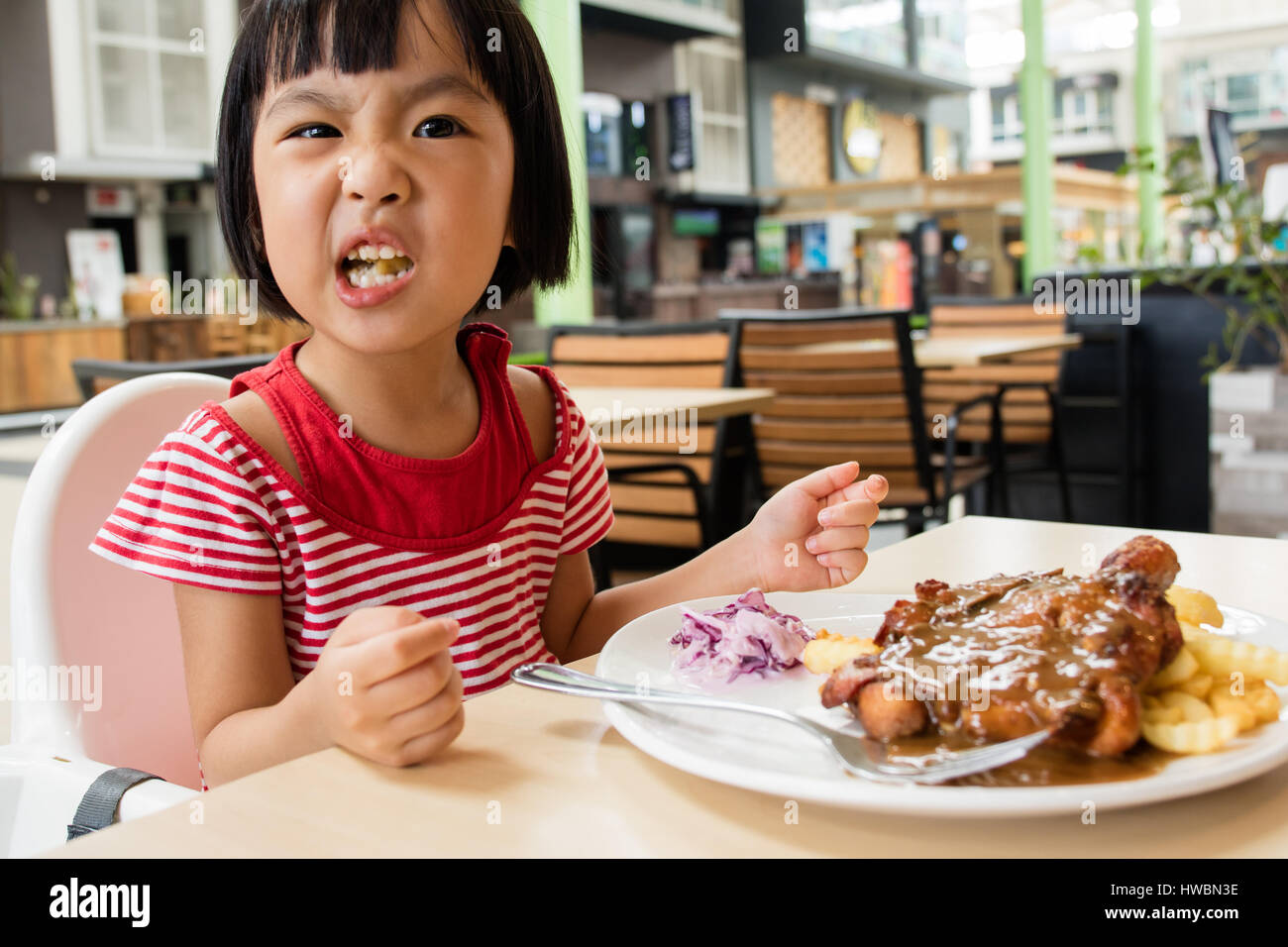 Asian Little Chinese Girl Eating Western Food in Outdoor Cafe Stock ...