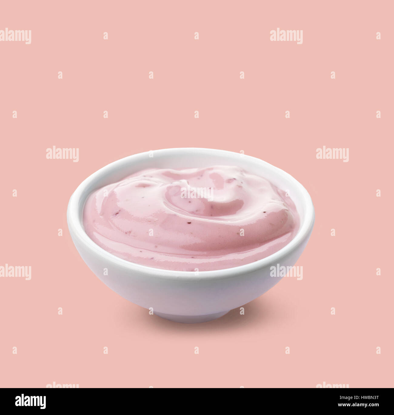 bowl of pink fruit yogurt on pink background Stock Photo - Alamy