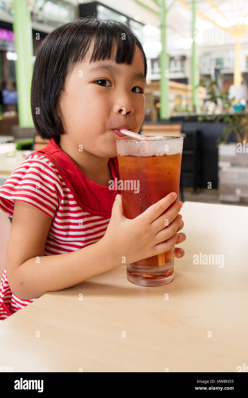 Asian Little Chinese Girl Drinking Ice Tea in Outdoor Cafe Stock Photo ...