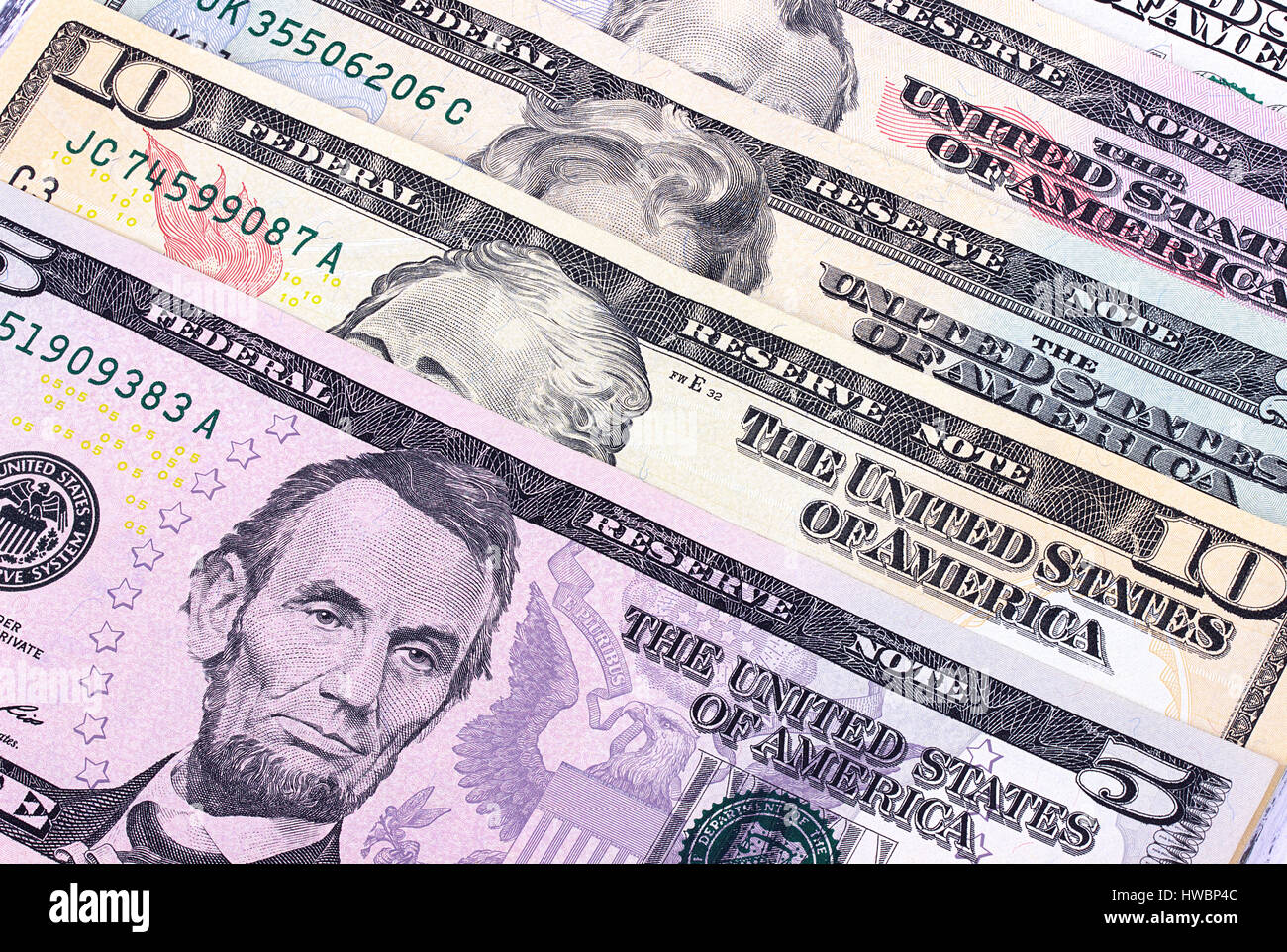 Abstract dollar bills of different denominations background Stock Photo ...