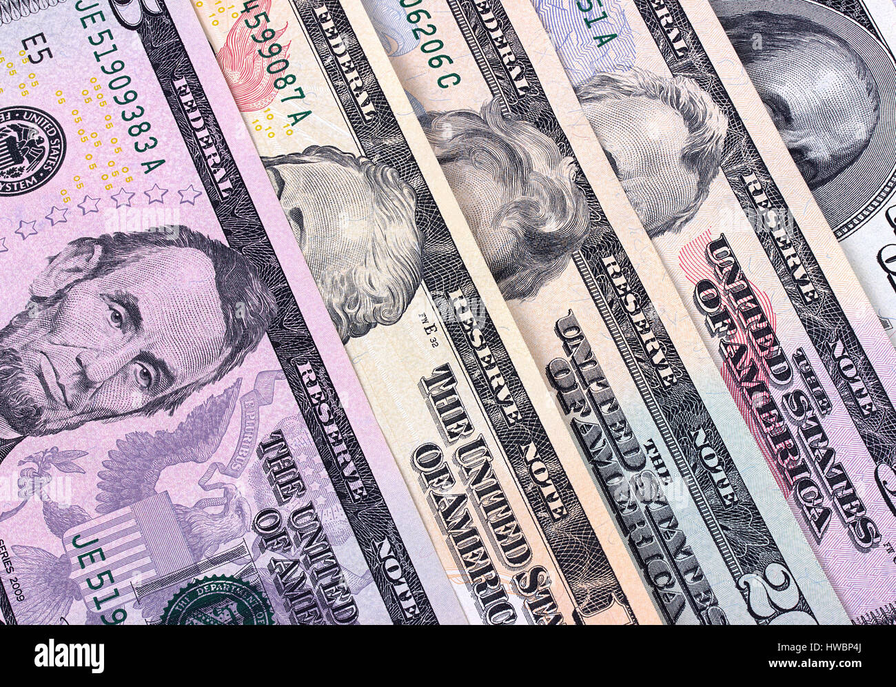 Abstract dollar bills of different denominations background Stock Photo ...