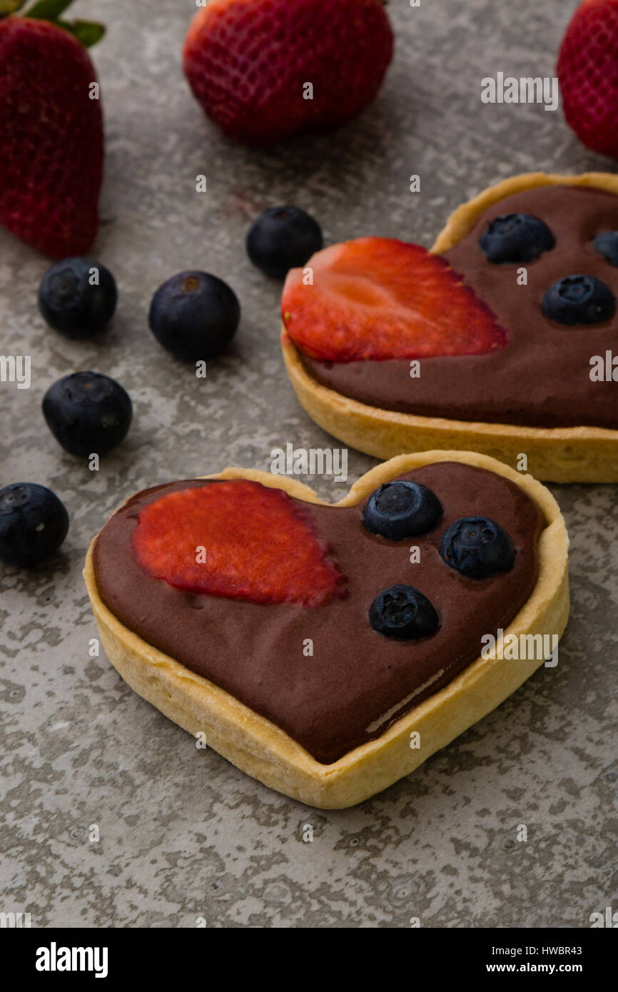 heart shape chocolate tart with strawberry and blueberry Stock Photo ...