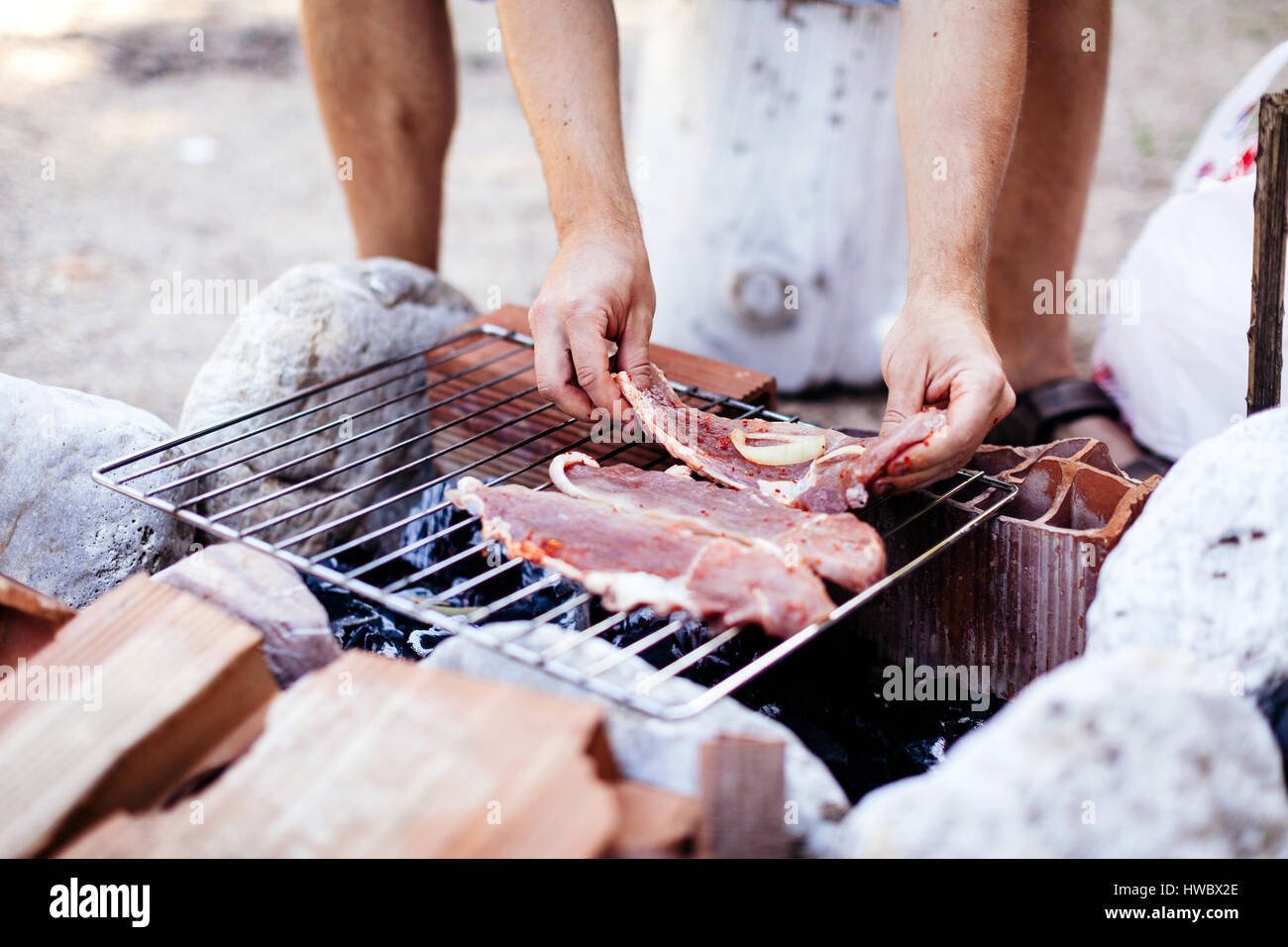 man cooking bbq steak meat nobody Stock Photo - Alamy