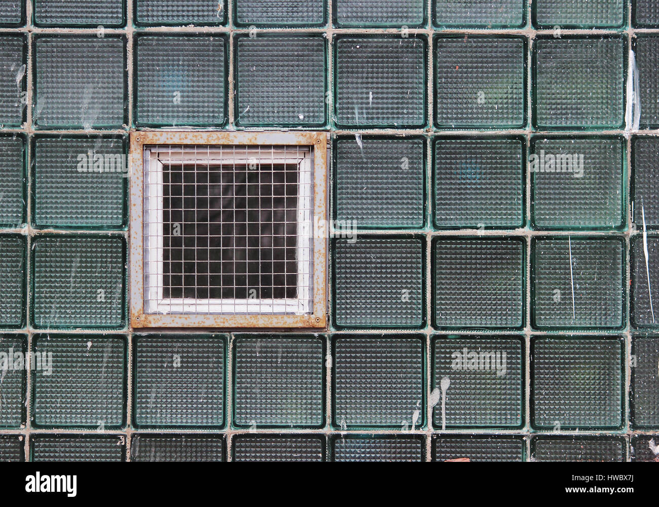 A window in a glass wall made of thick-walled batch cells Stock Photo ...