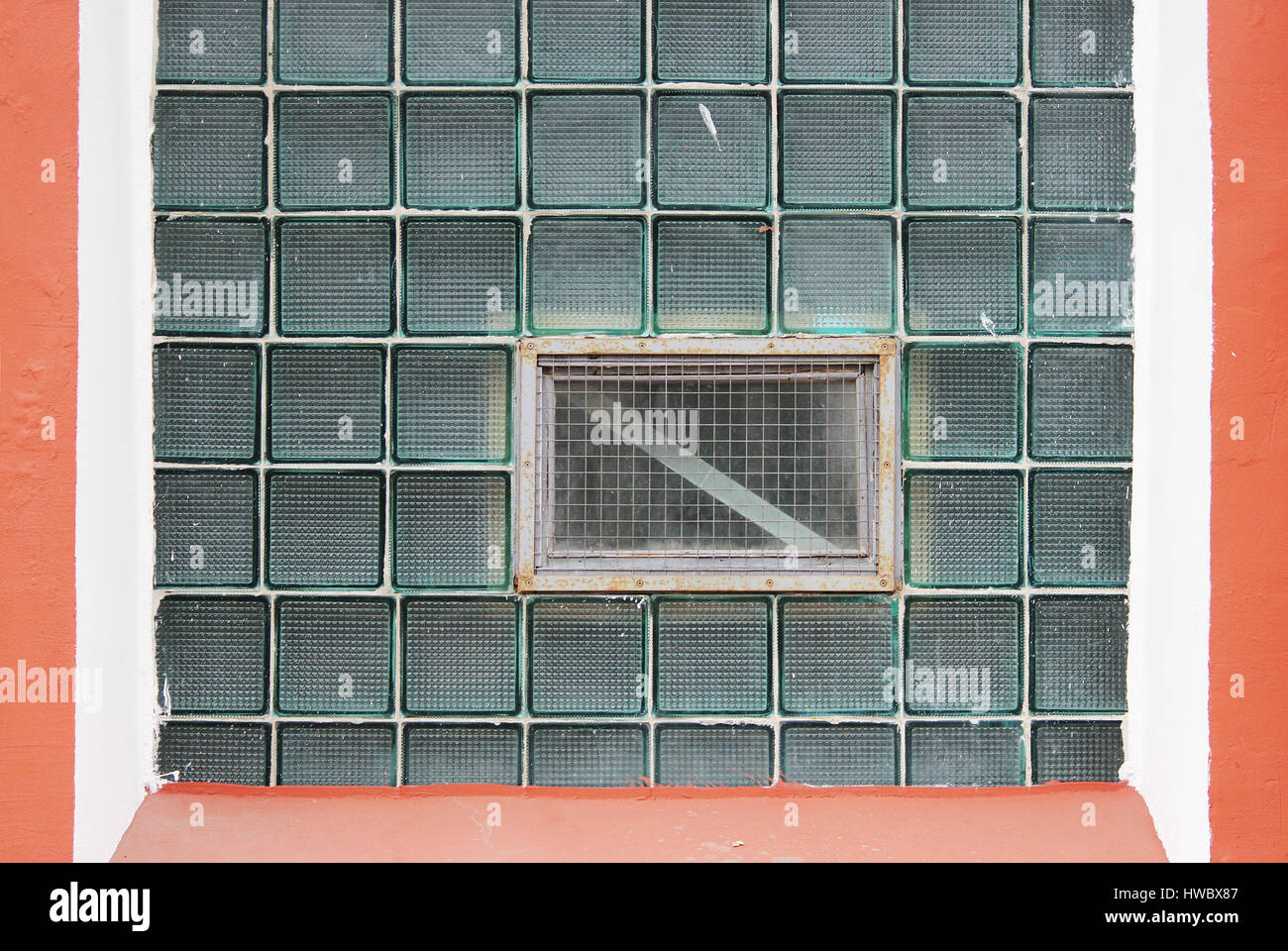 A window in a glass wall made of thick-walled batch cells Stock Photo ...