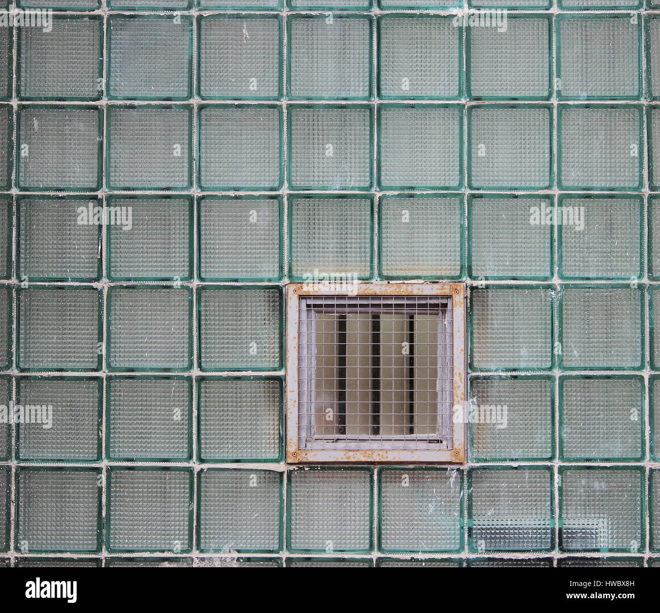 A window in a glass wall made of thick-walled batch cells Stock Photo ...