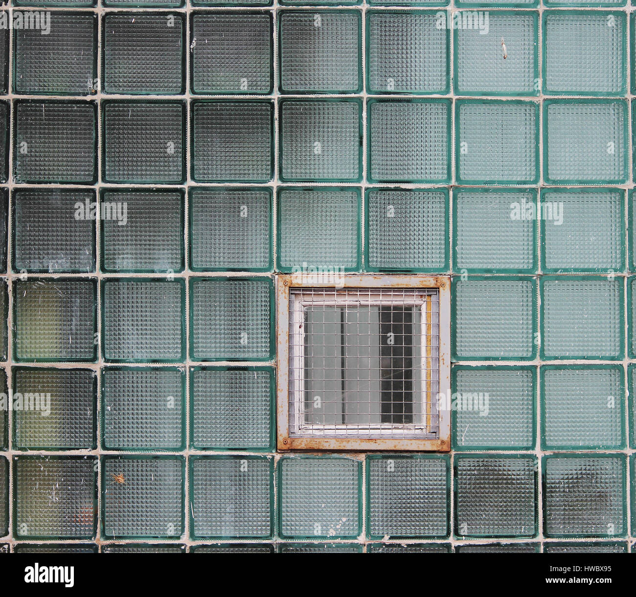 A window in a glass wall made of thick-walled batch cells Stock Photo ...
