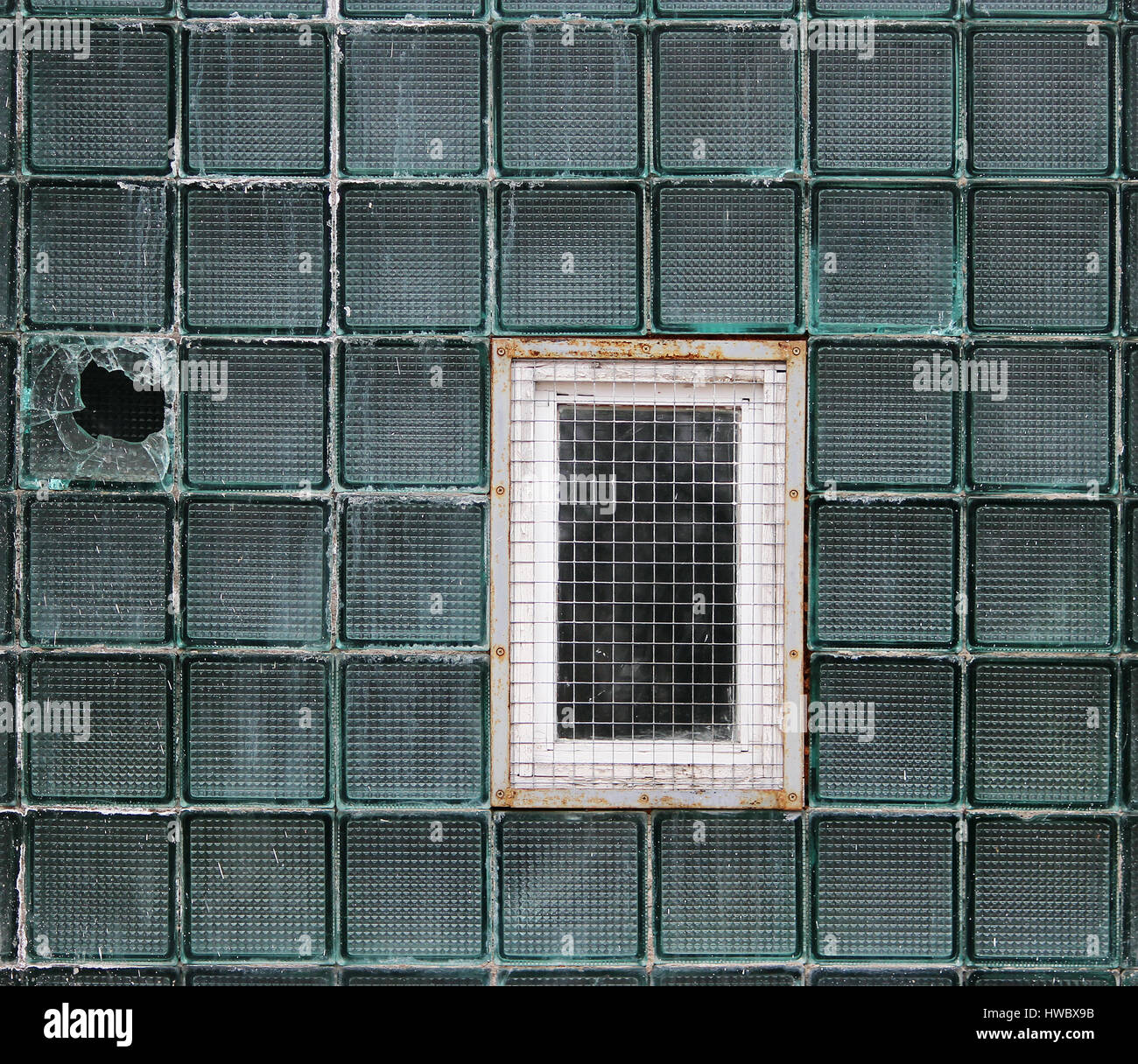 A window in a glass wall made of thick-walled batch cells Stock Photo ...