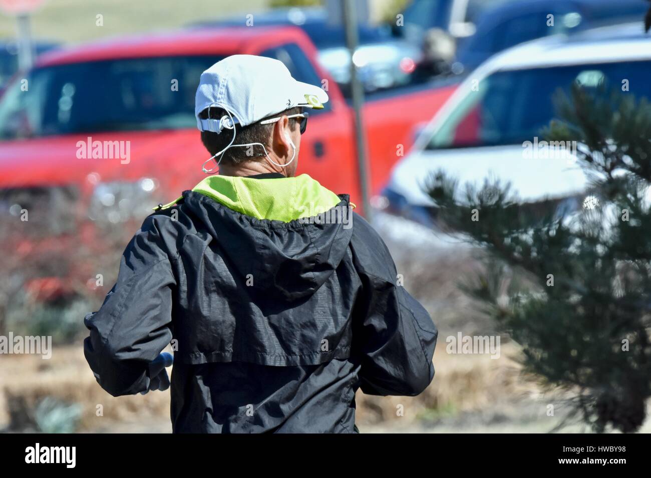 Jogger running on a park trail Stock Photo - Alamy