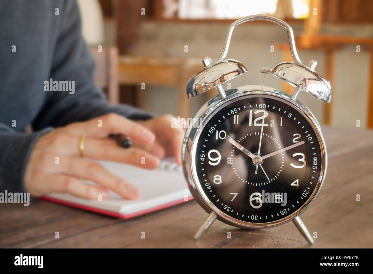 Alarm Clock On Wooden Work Table, stock photo Stock Photo - Alamy