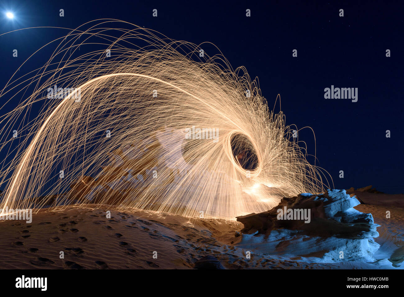 Burning Steel Wool spinning. Showers of glowing sparks from spinning ...