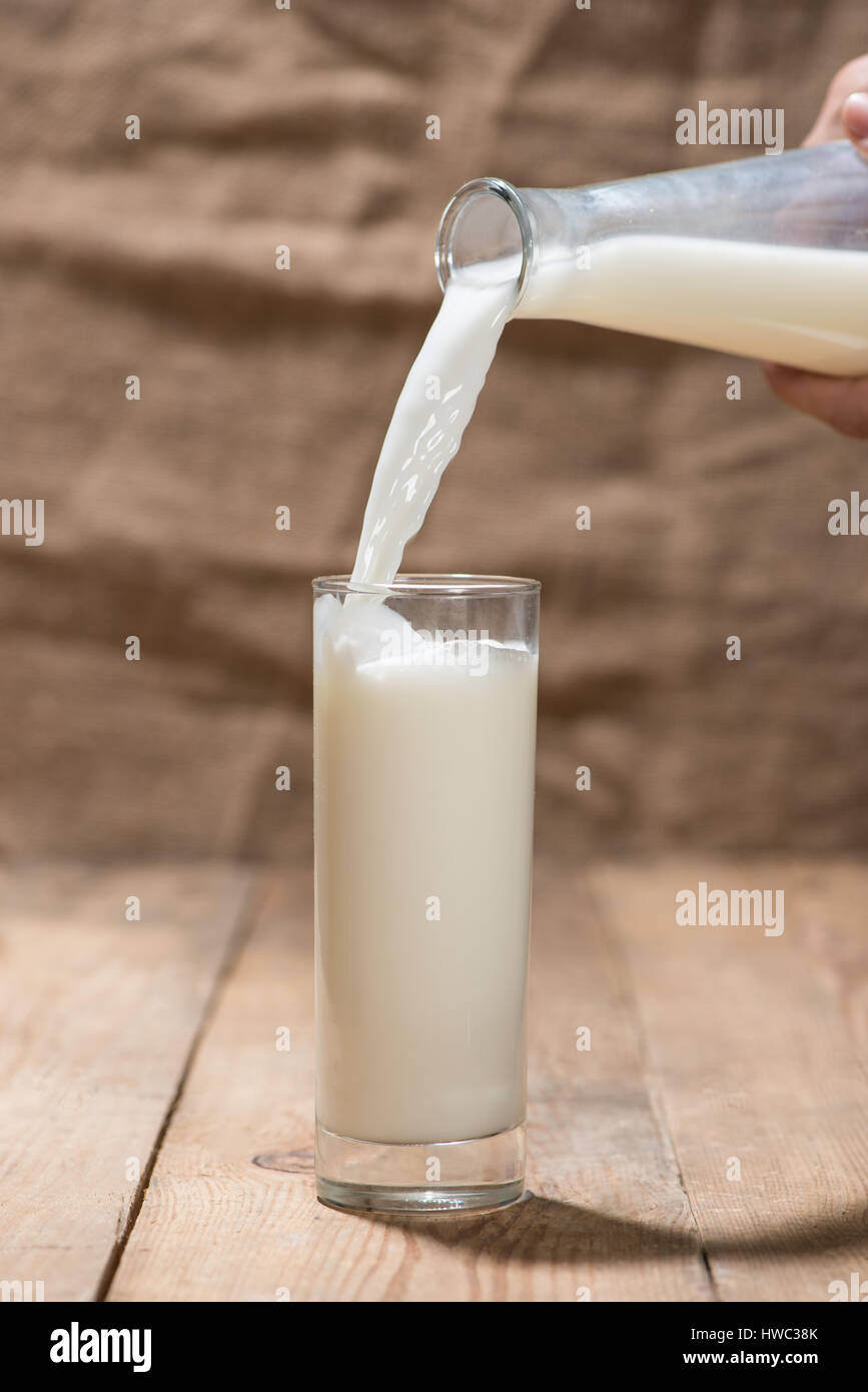 Milk. Image of Milk fall into glass Stock Photo - Alamy