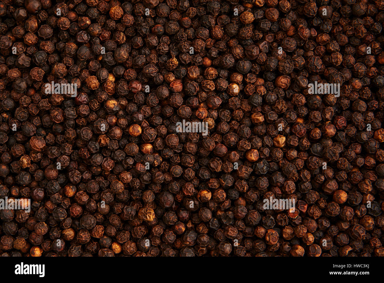 Black Pepper Corns Close up, Filling the frame and close enough to see ...