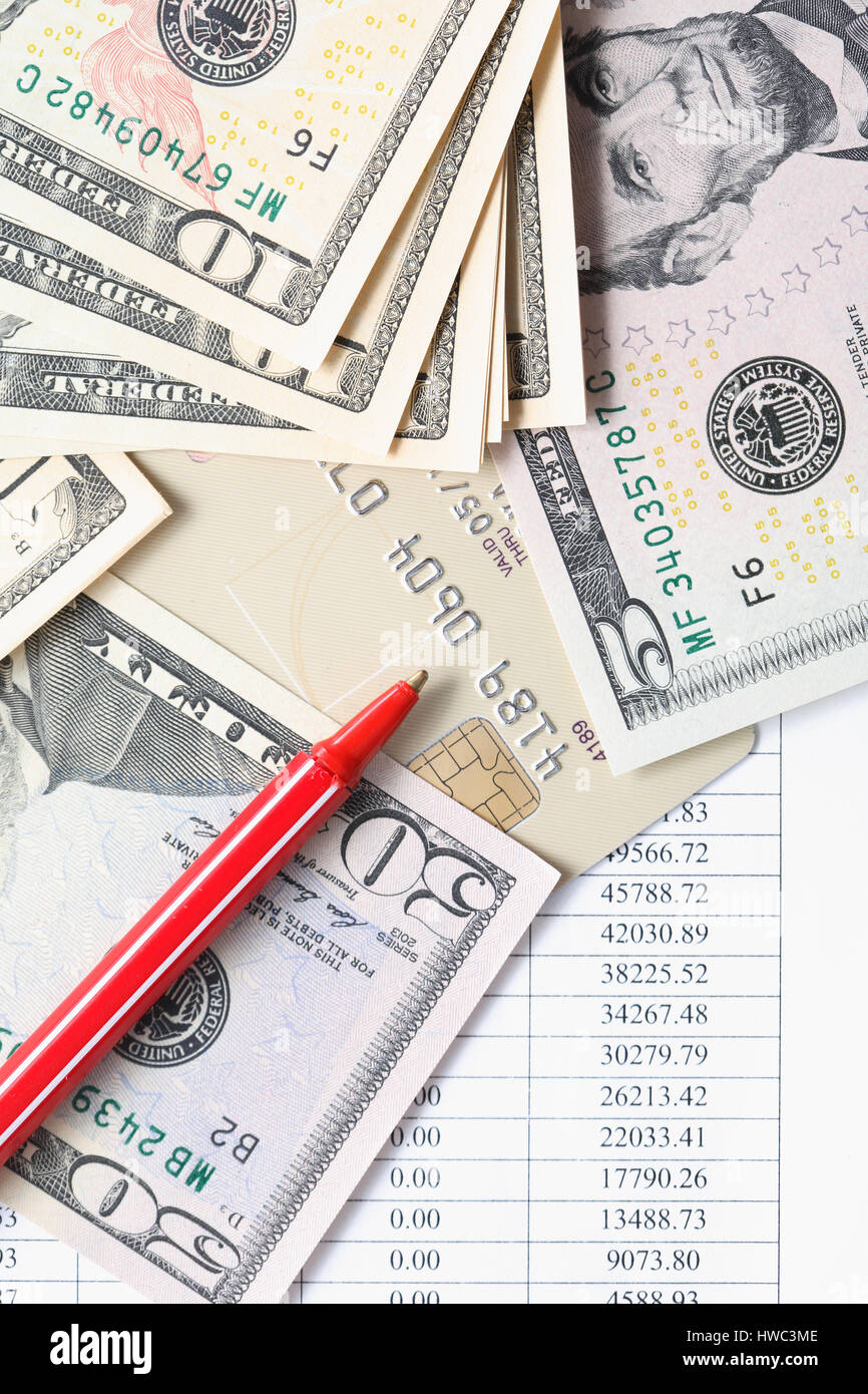 Credit card near money and pen on paper background with digits Stock ...