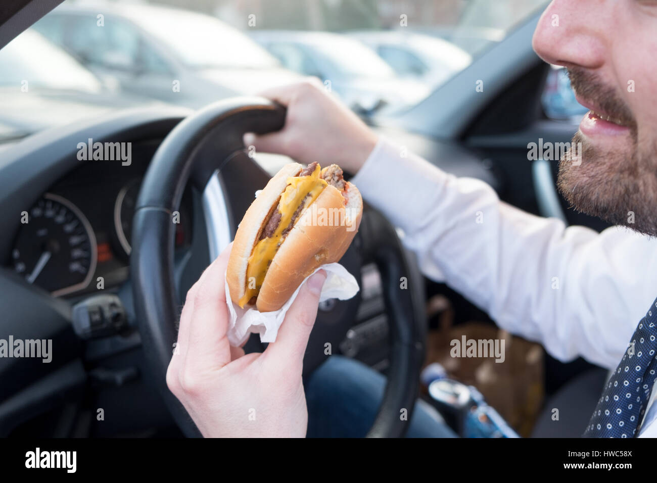 Man eating burger hurry hi-res stock photography and images - Alamy