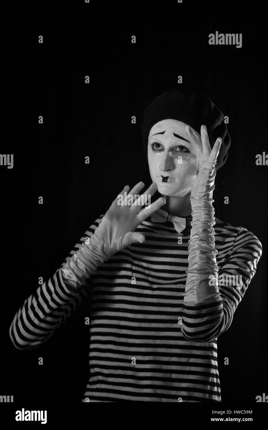 Emotional professional mime in stripped blacn and white shirt with ...