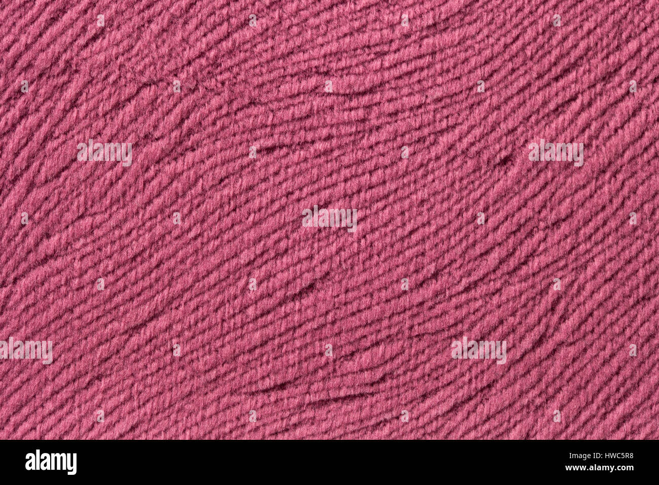 Dark pink background from a soft wool textile material closeup. Fabric ...