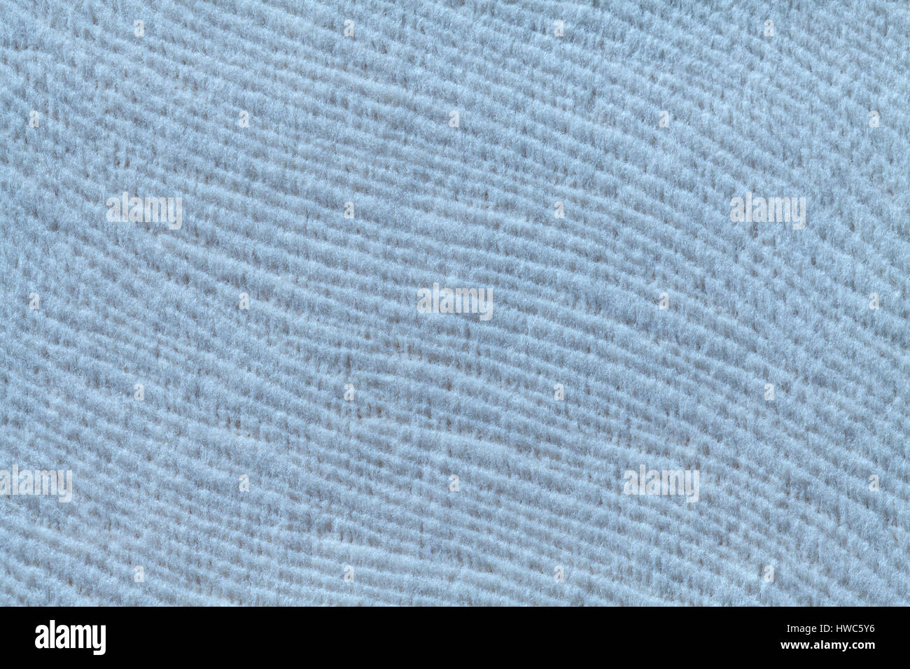 Light blue background from a soft wool textile material closeup. Fabric ...