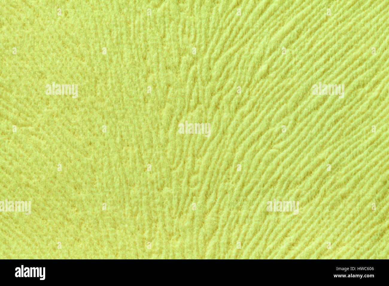 Light green background from a soft wool textile material closeup ...