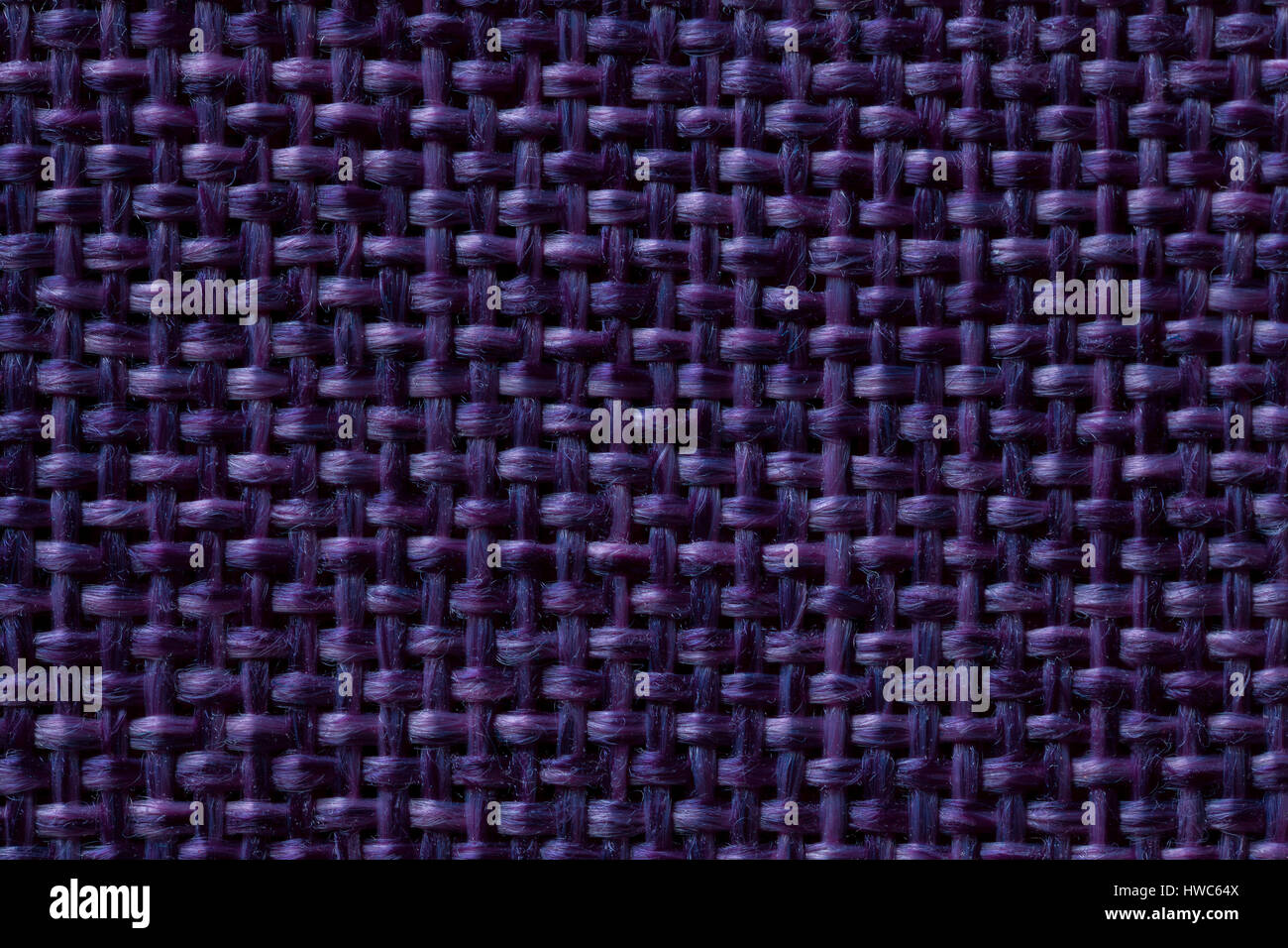 Dark blue background with checkered pattern, closeup. Structure of the ...