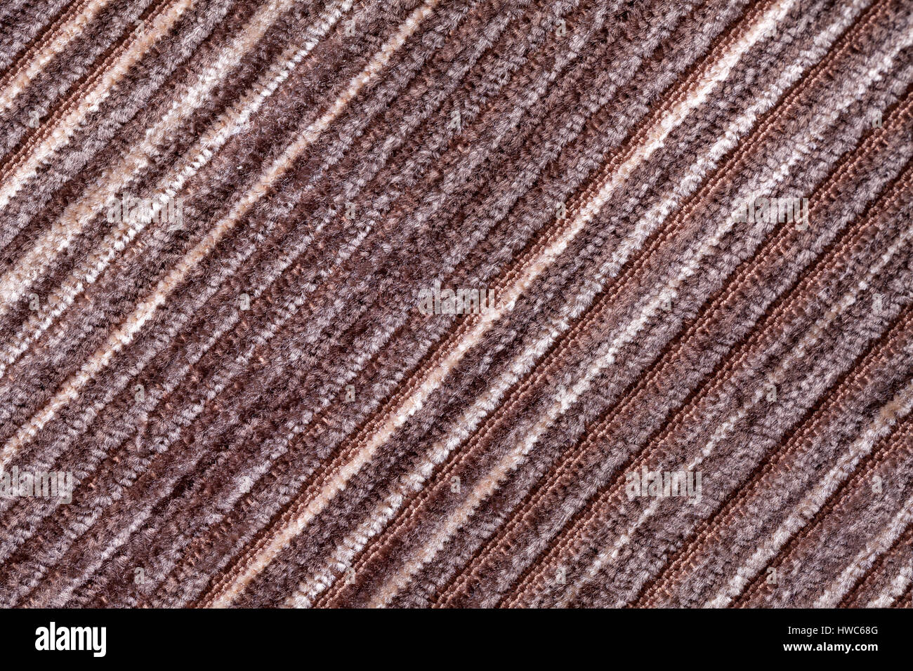 Brown background of a knitted textile material with pattern of diagonal ...