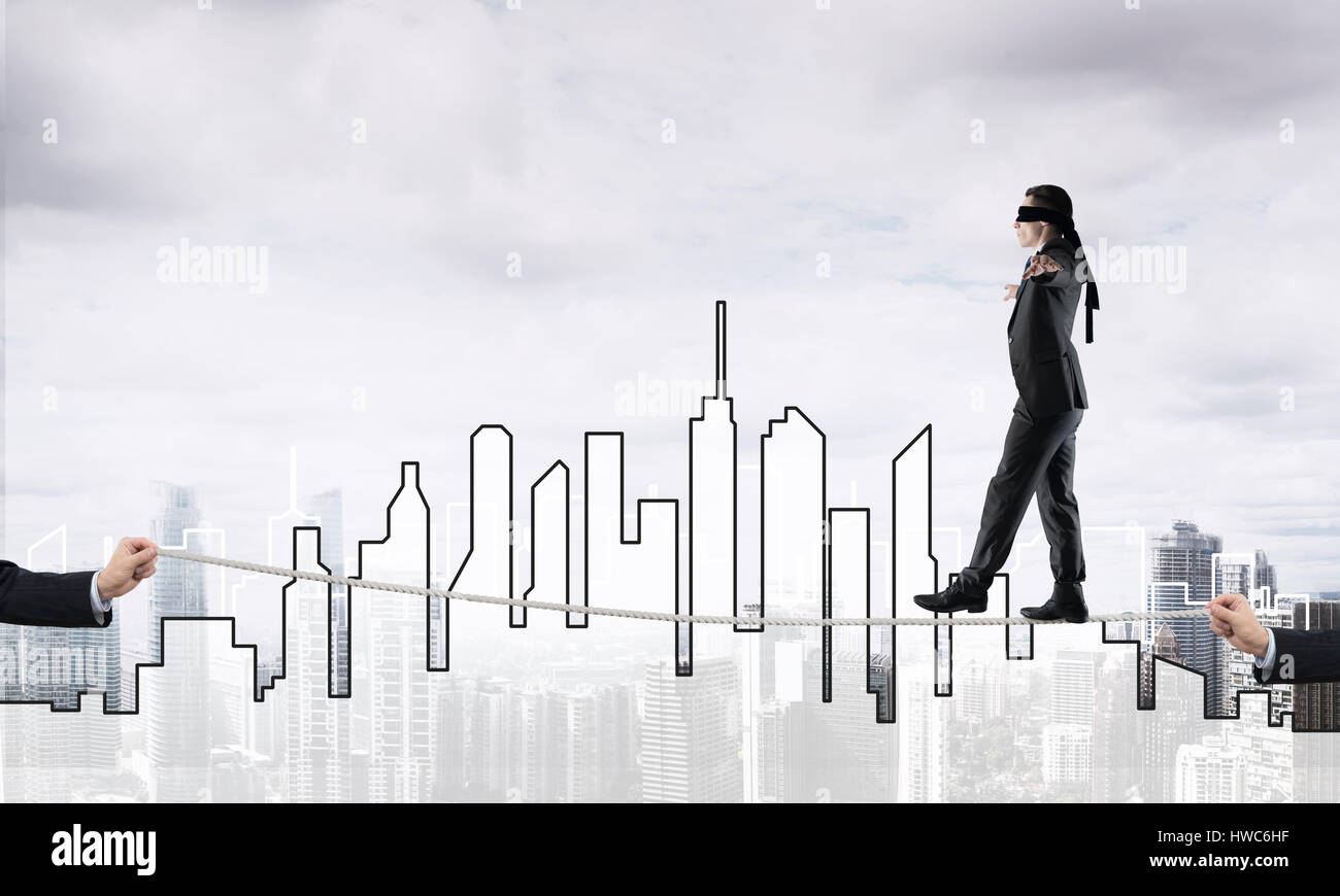 Business concept of risk support and assistance with man balancing on ...