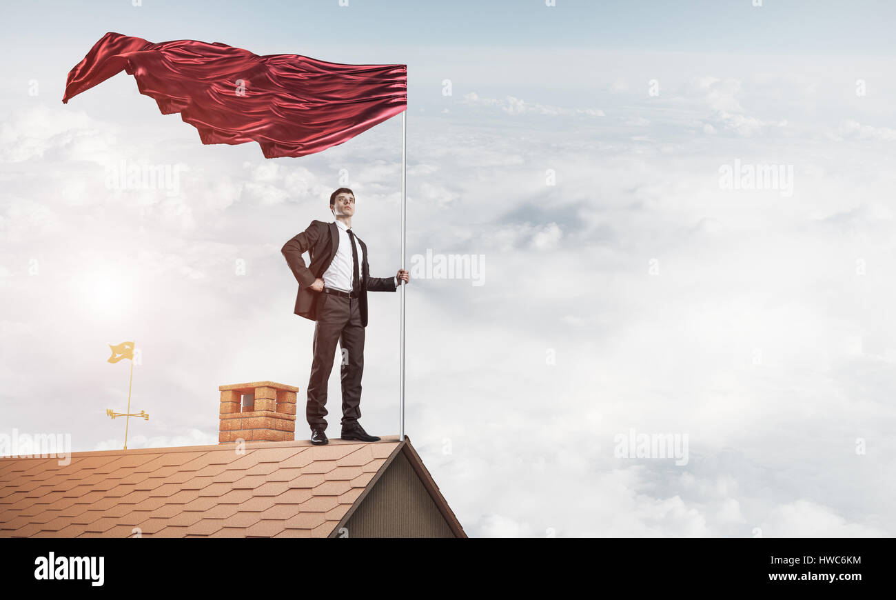 Young businessman with flag presenting concept of leadership. Mi Stock ...