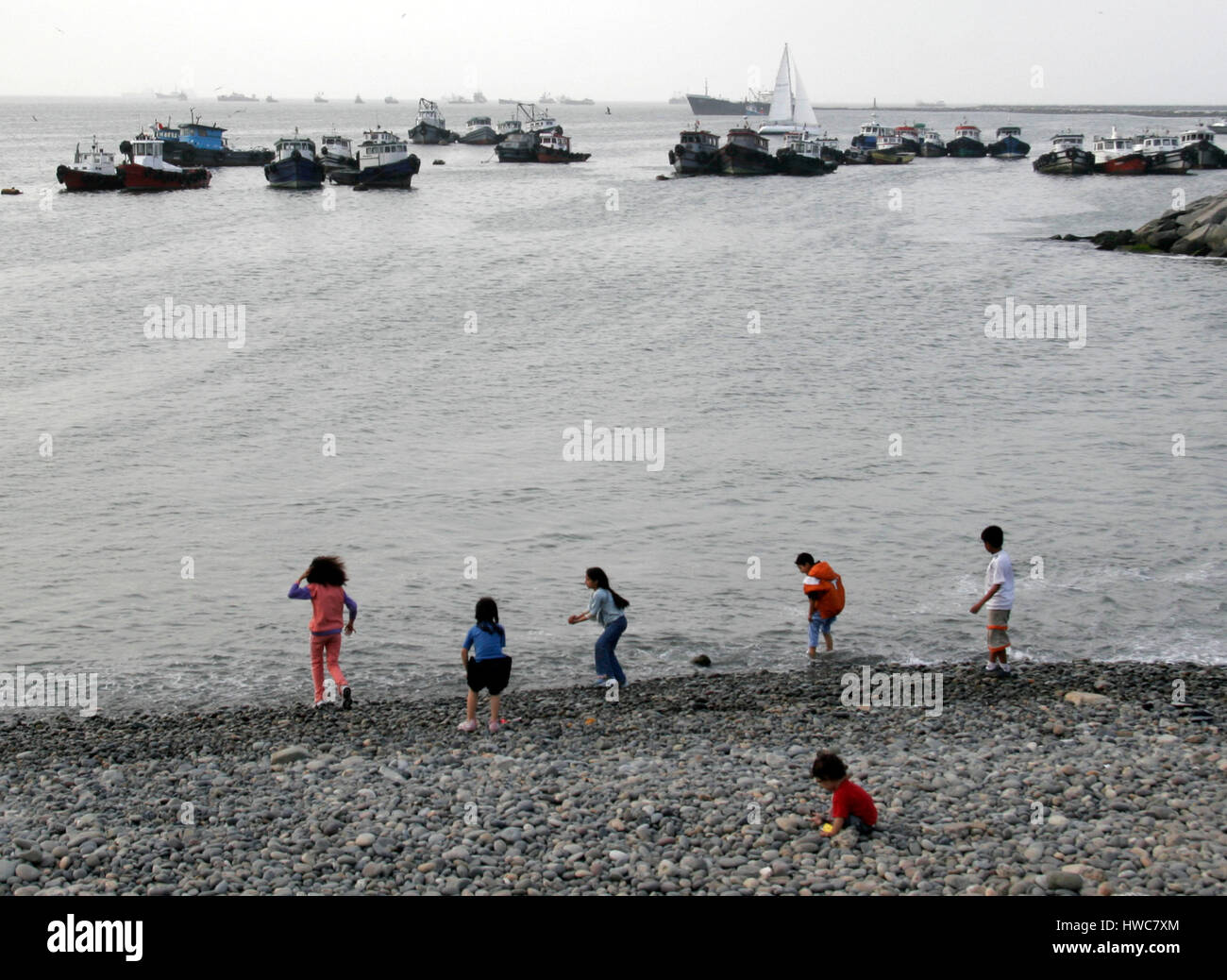 Children along the beach in a marina in Lima, Peru on November 10, 2005 ...