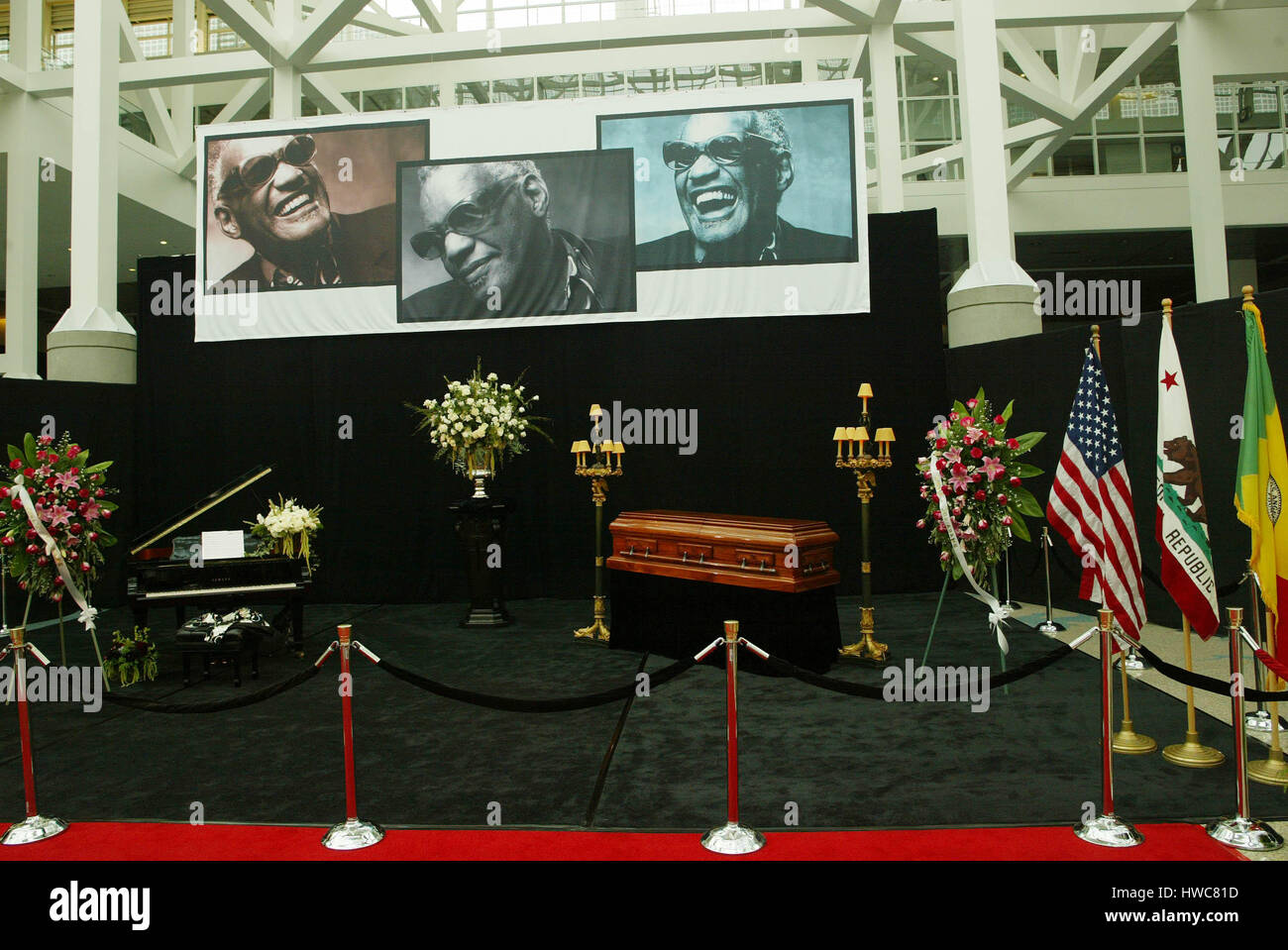 A baby grand piano adorn the area around the casket of singer Ray ...