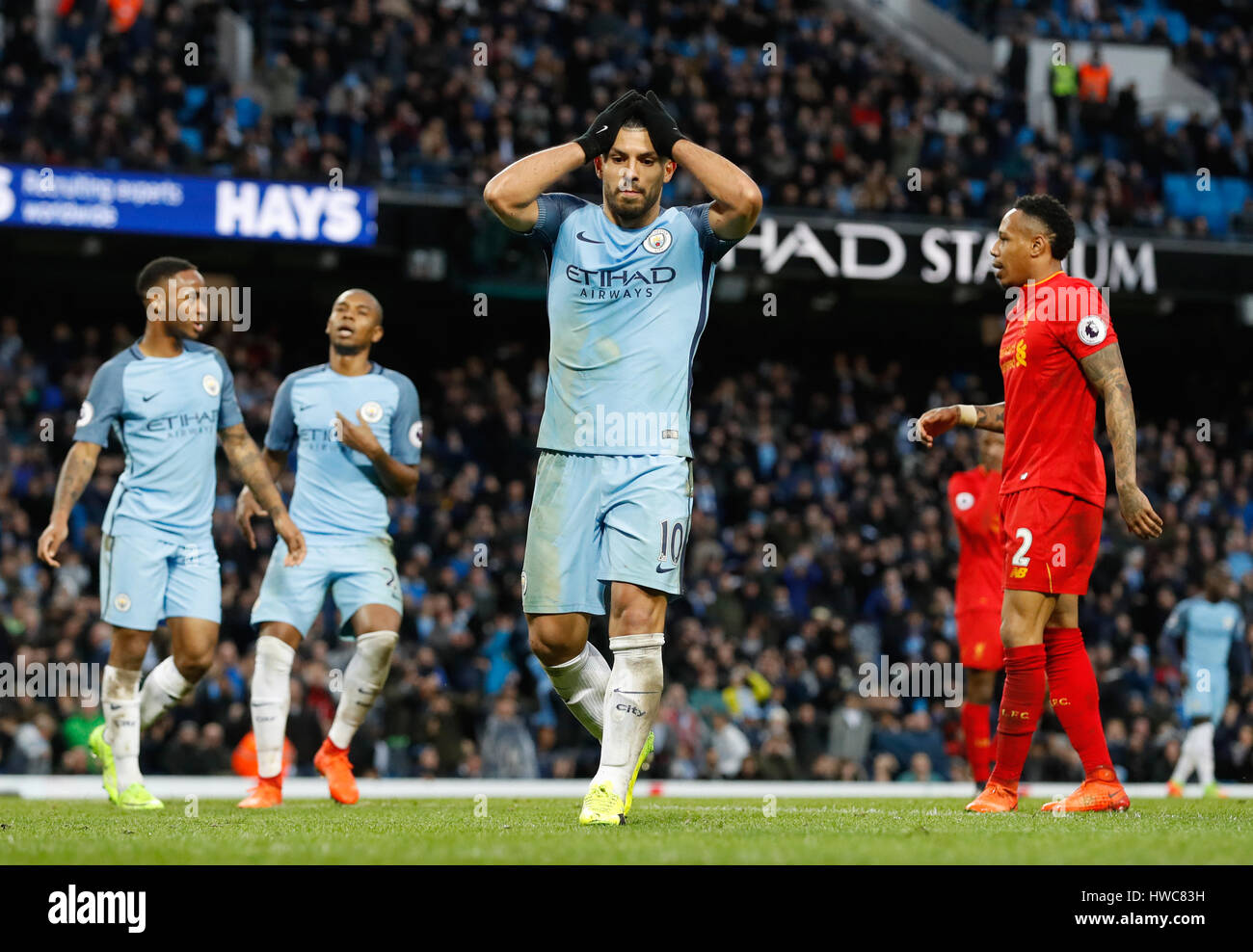 Manchester City's Sergio Aguero (second right) reacts after missinga ...