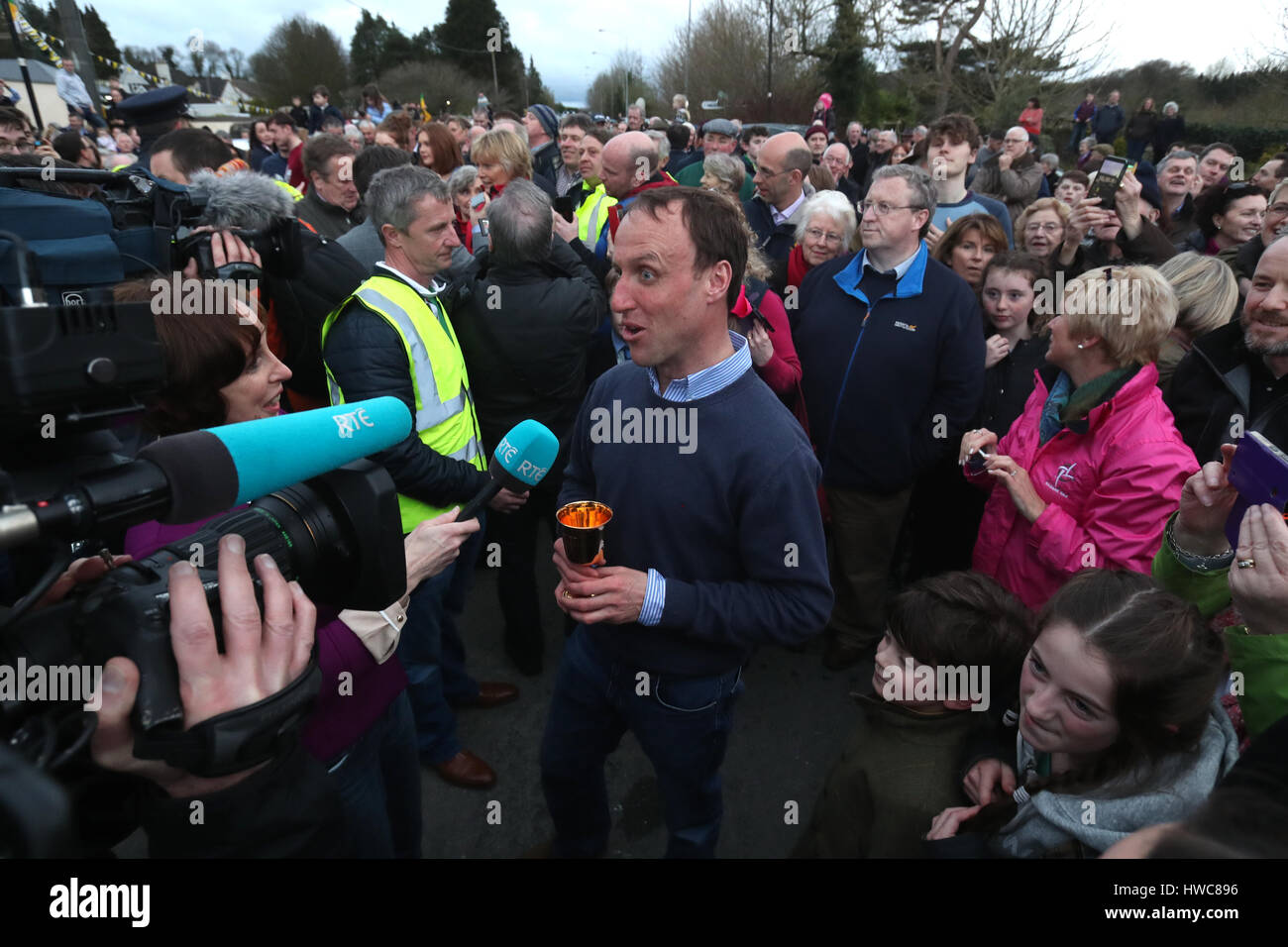 Sizing John jockey Will Power is interviewed during a parade through ...