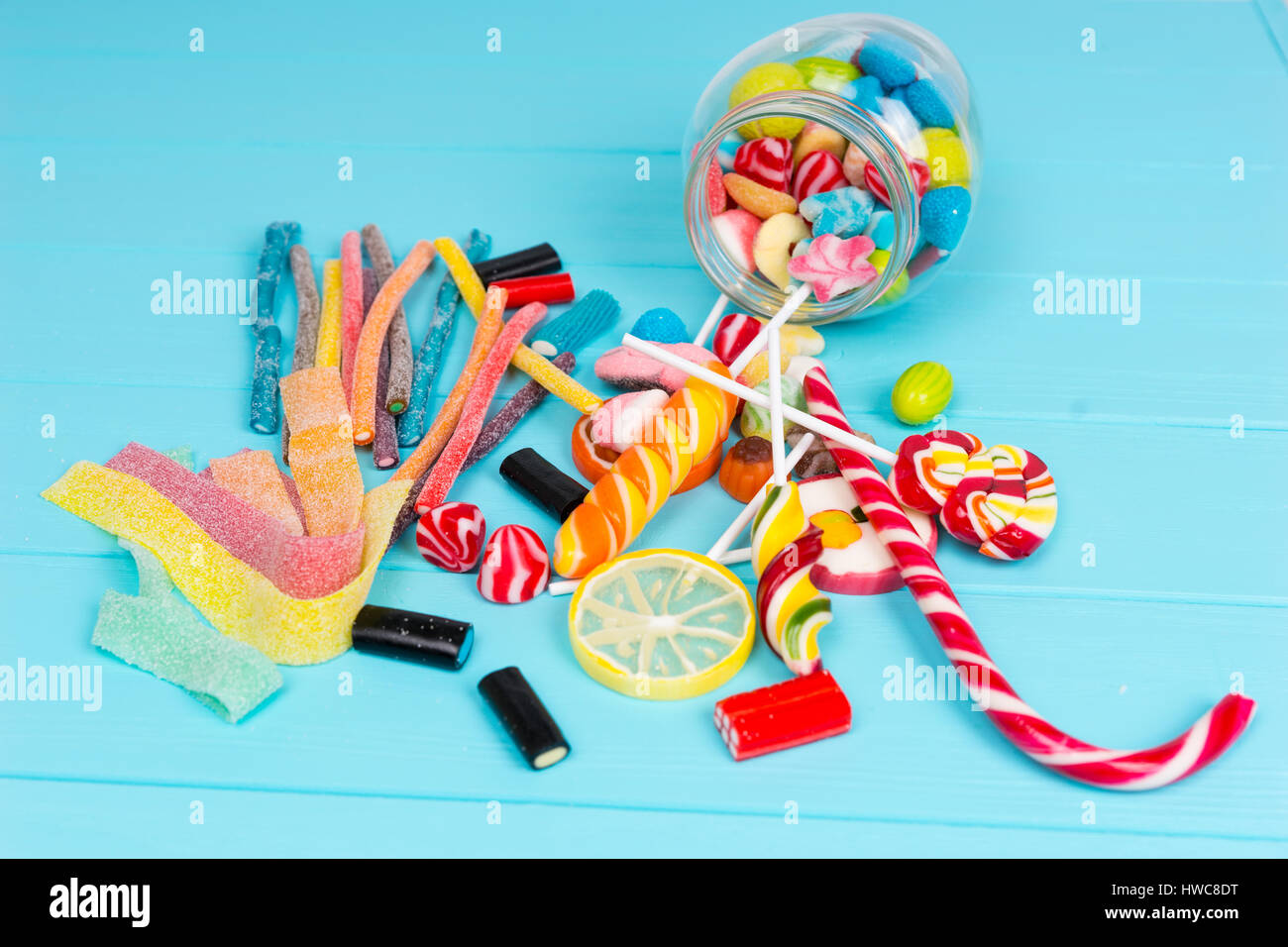 Close up of cattered chewing sweets, lollipops and jelly candies from ...