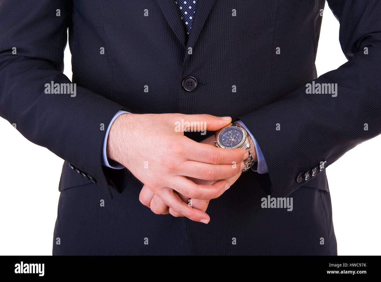 Businessman checking time on his wristwatch Stock Photo - Alamy