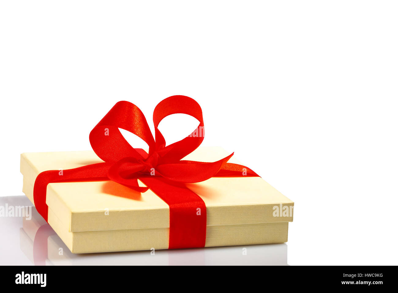 present with red ribbon isolated on white backround Stock Photo - Alamy