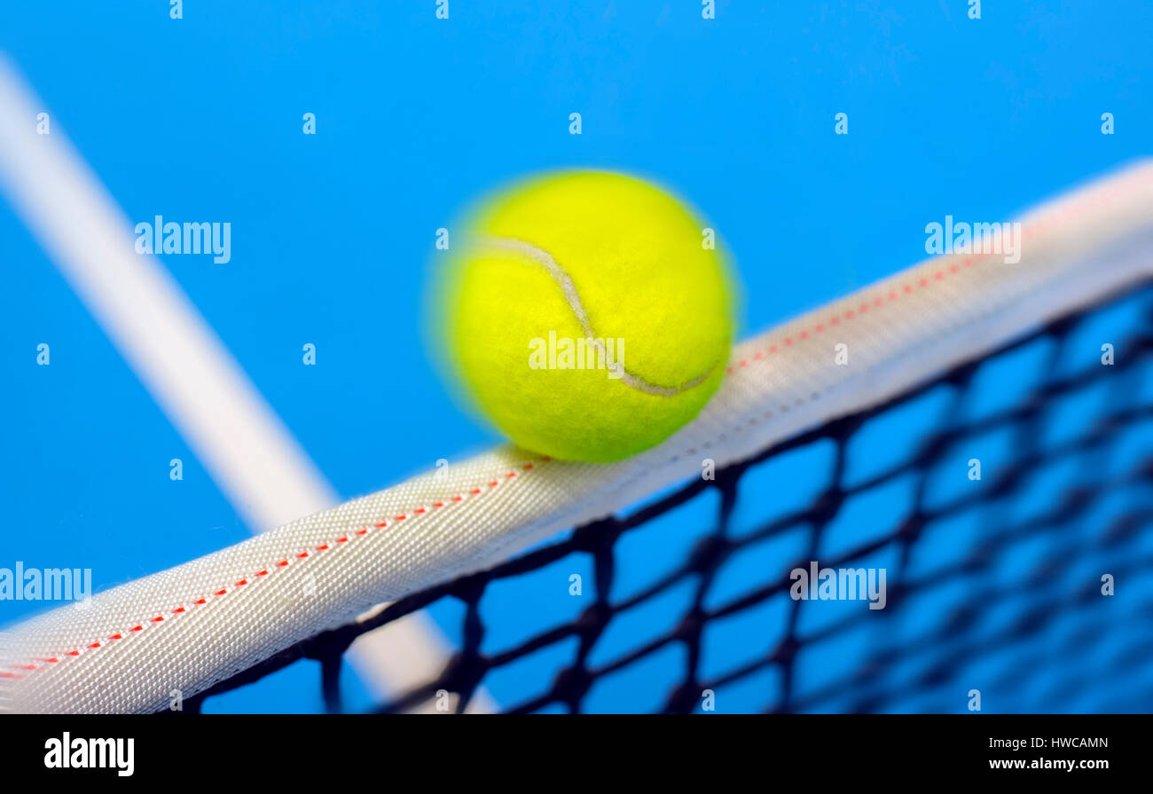 Tennis ball hitting the net Stock Photo - Alamy