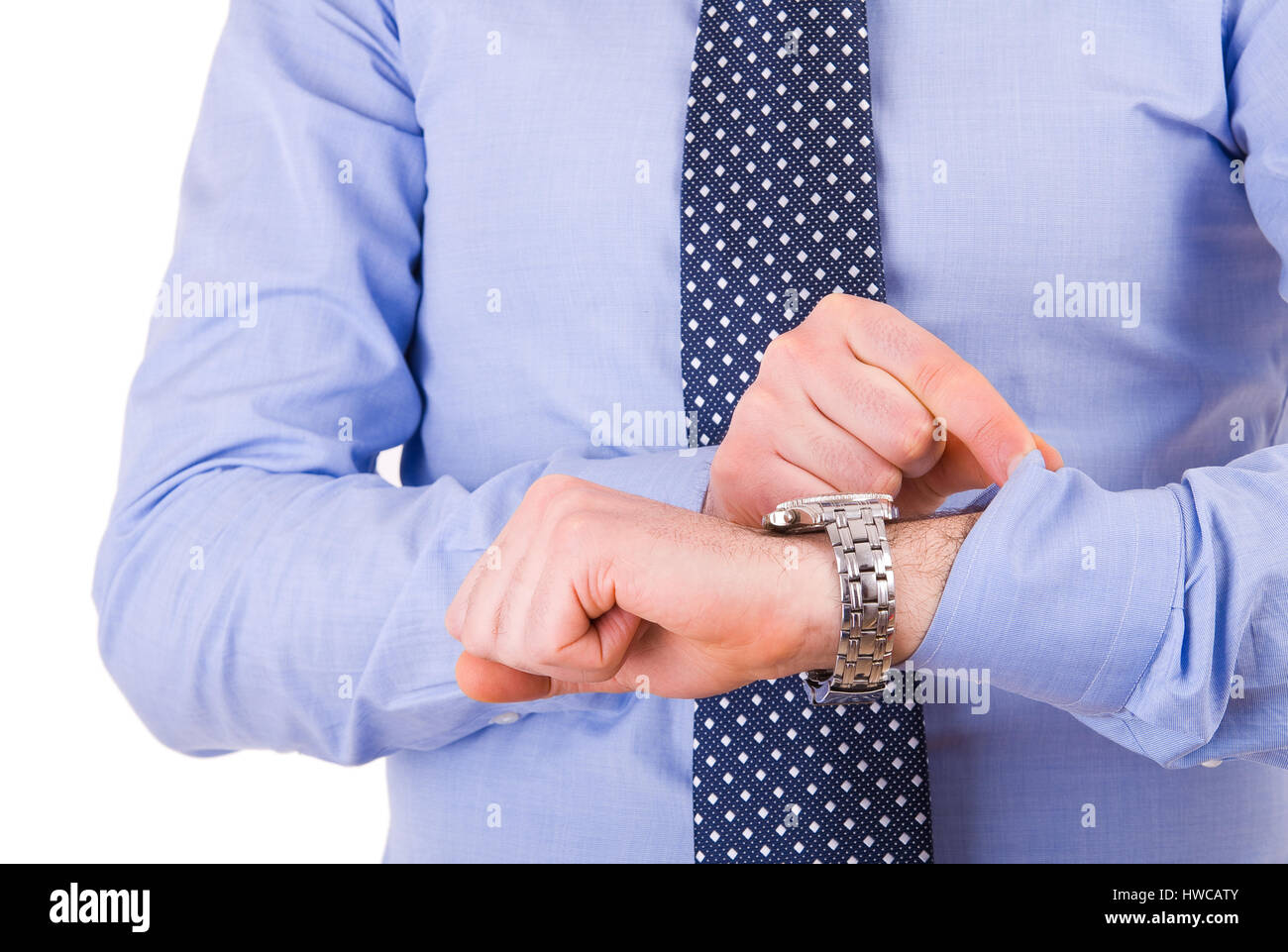 Businessman checking time on his wristwatch Stock Photo - Alamy