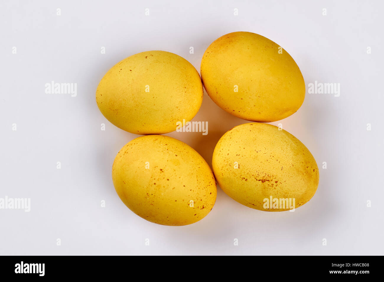 Yellow dyed eggs Stock Photo - Alamy
