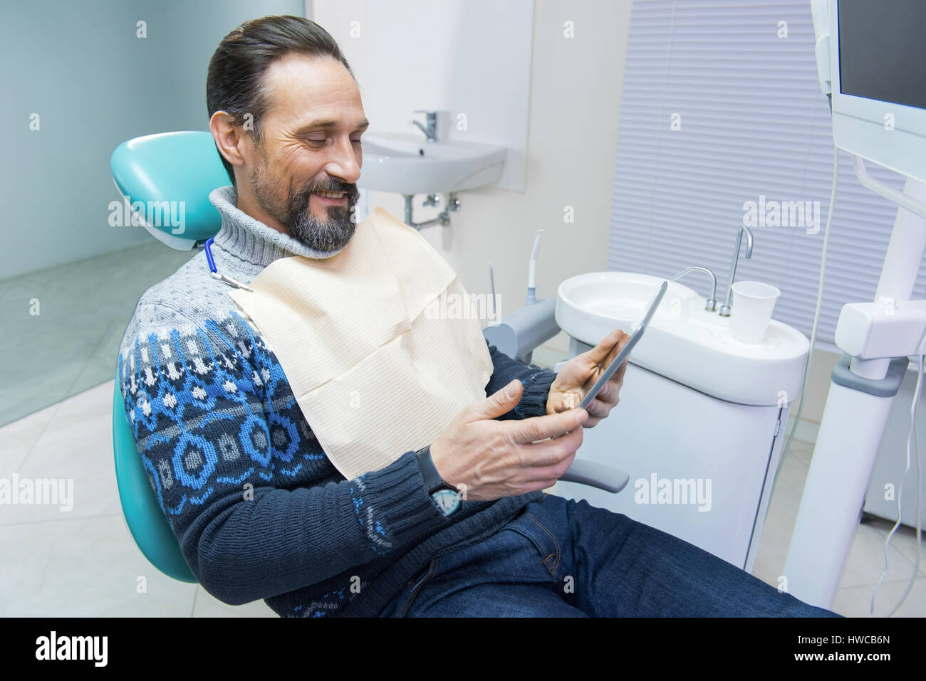Mature man in dentist office hi-res stock photography and images - Alamy