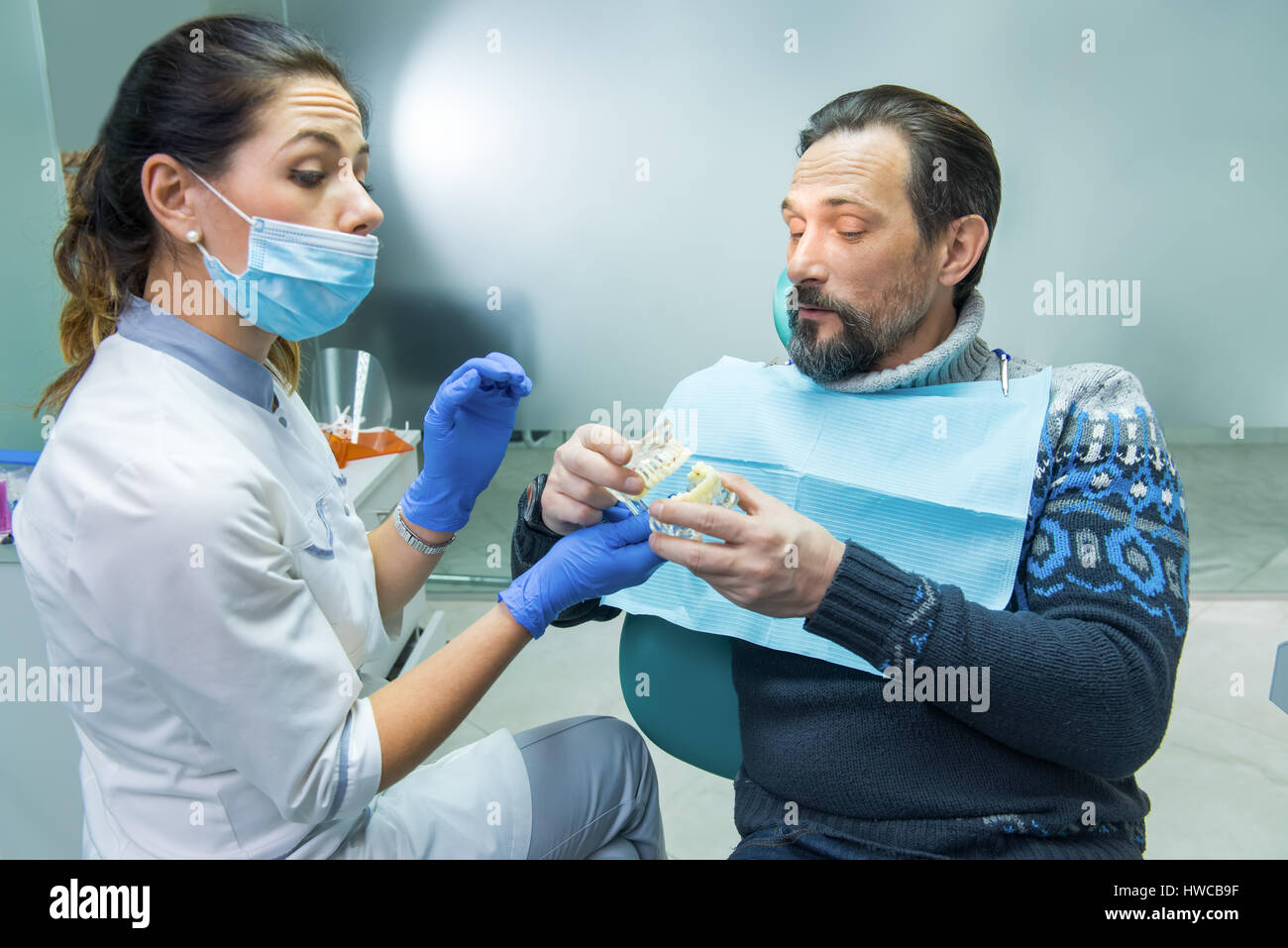 Professional dentist holding stomatological hi-res stock photography ...