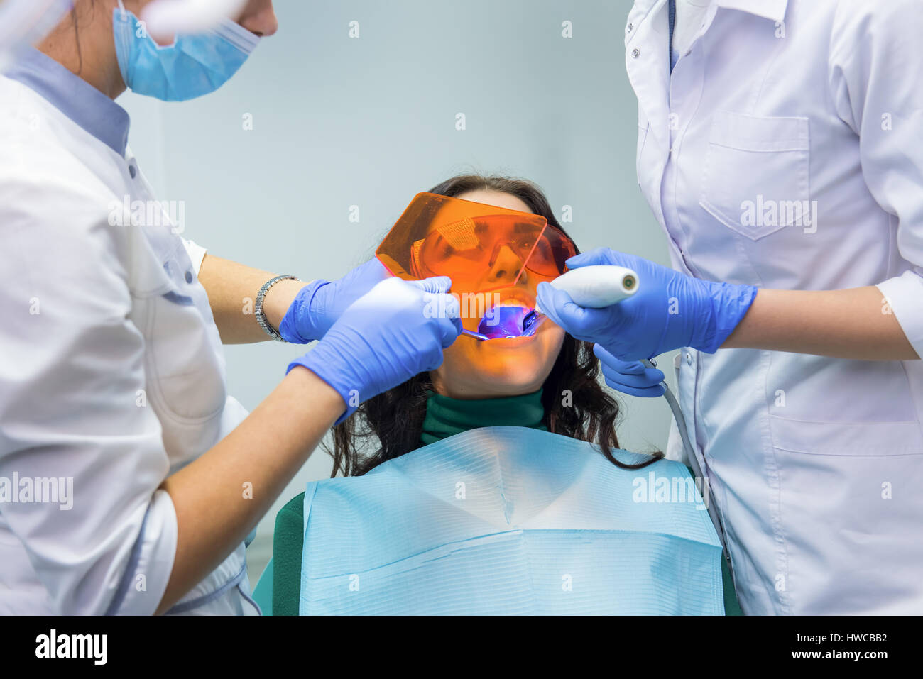 Dental doctor using uv light Stock Photo - Alamy