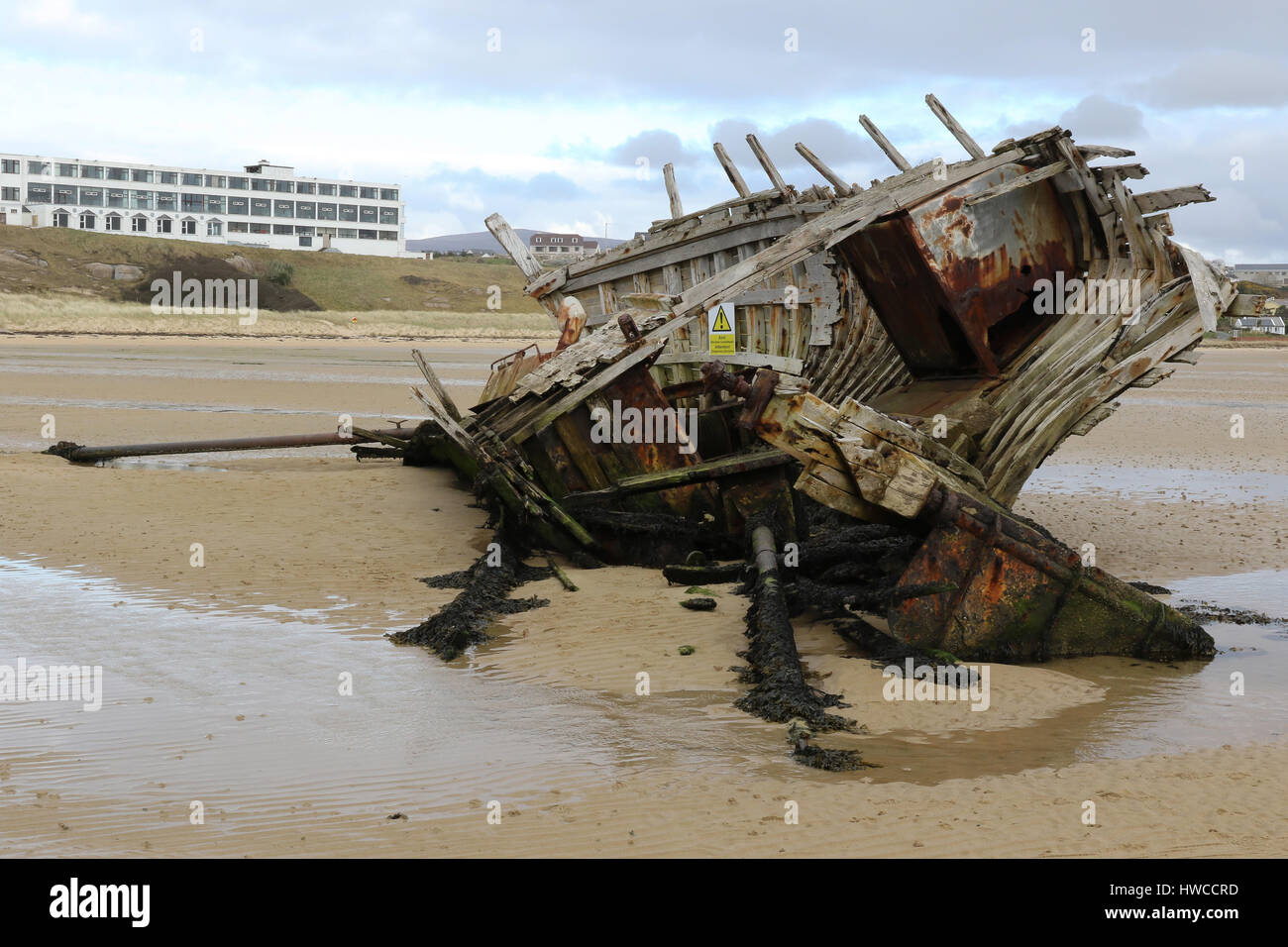 The wreck of a wooden fishing boat at Bunbeg, County Donegal, Ireland ...